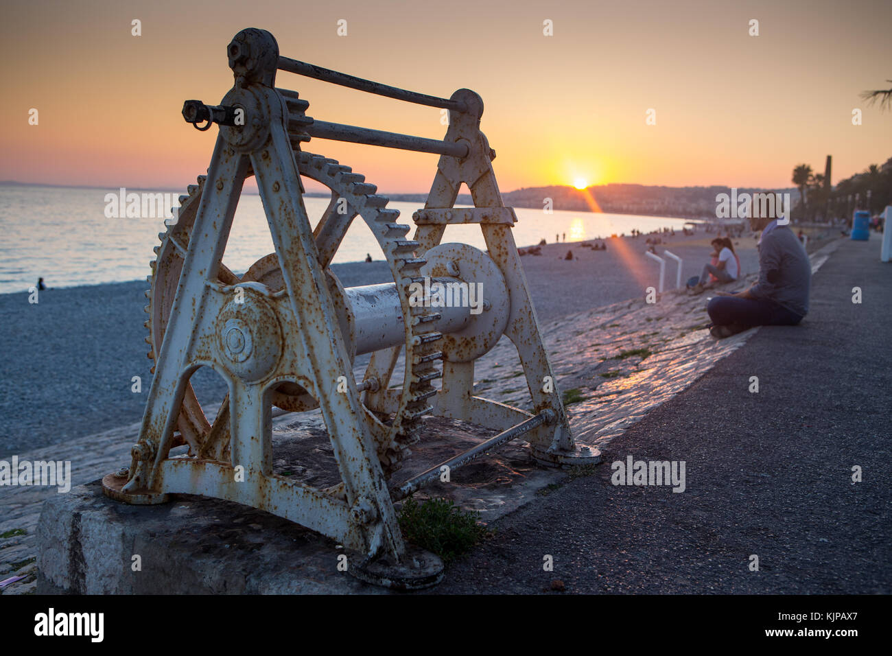 Machine with cogs and wheels on the beach at Nice Stock Photo - Alamy