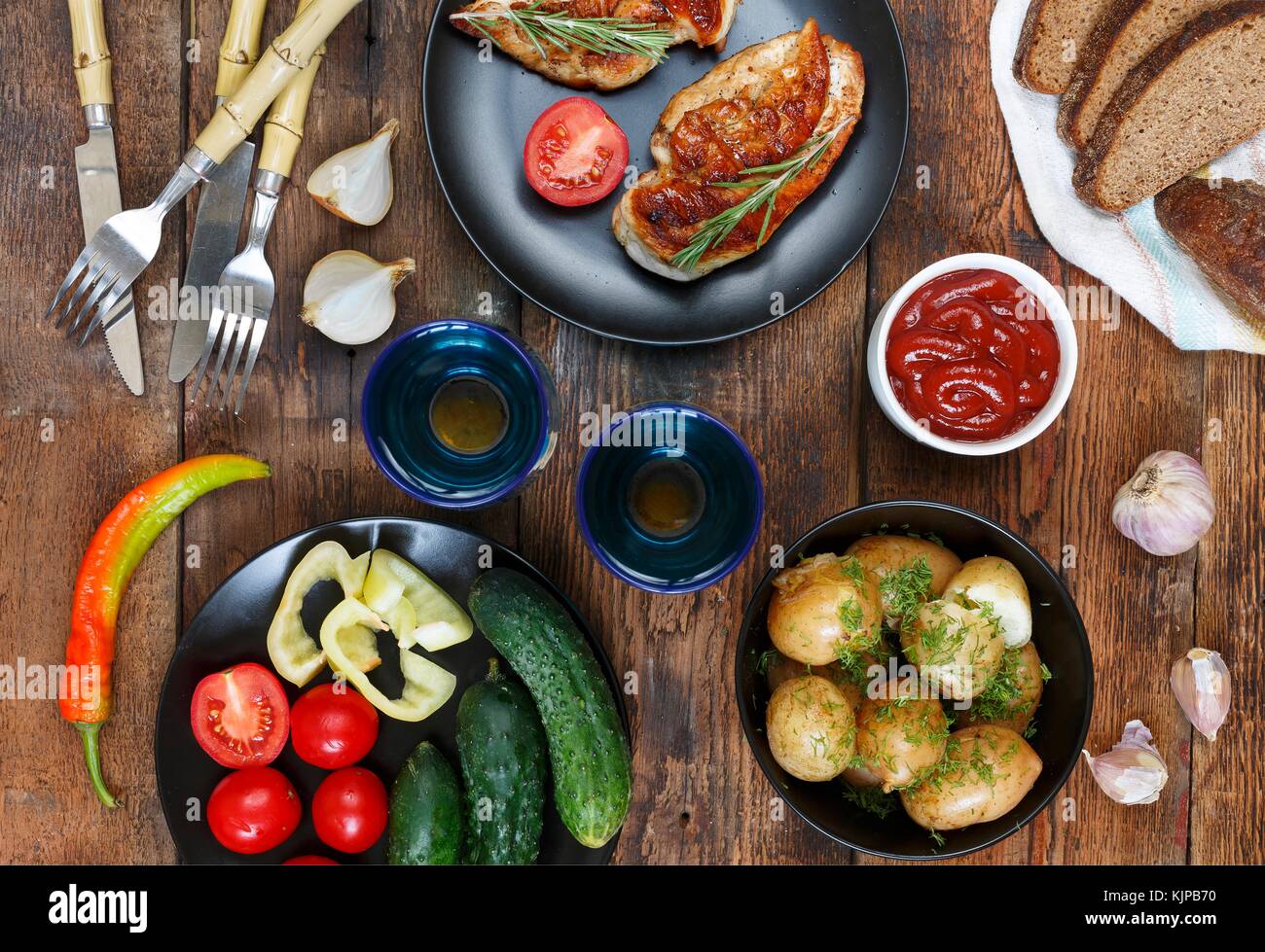 Dining table with various snacks and dishes, top view. The concept of ...