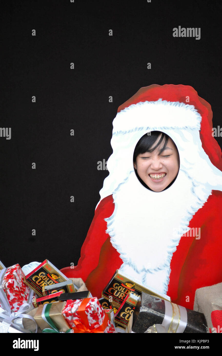 London, UK. 24th November, 2017. A young Japanese woman posing in a ...
