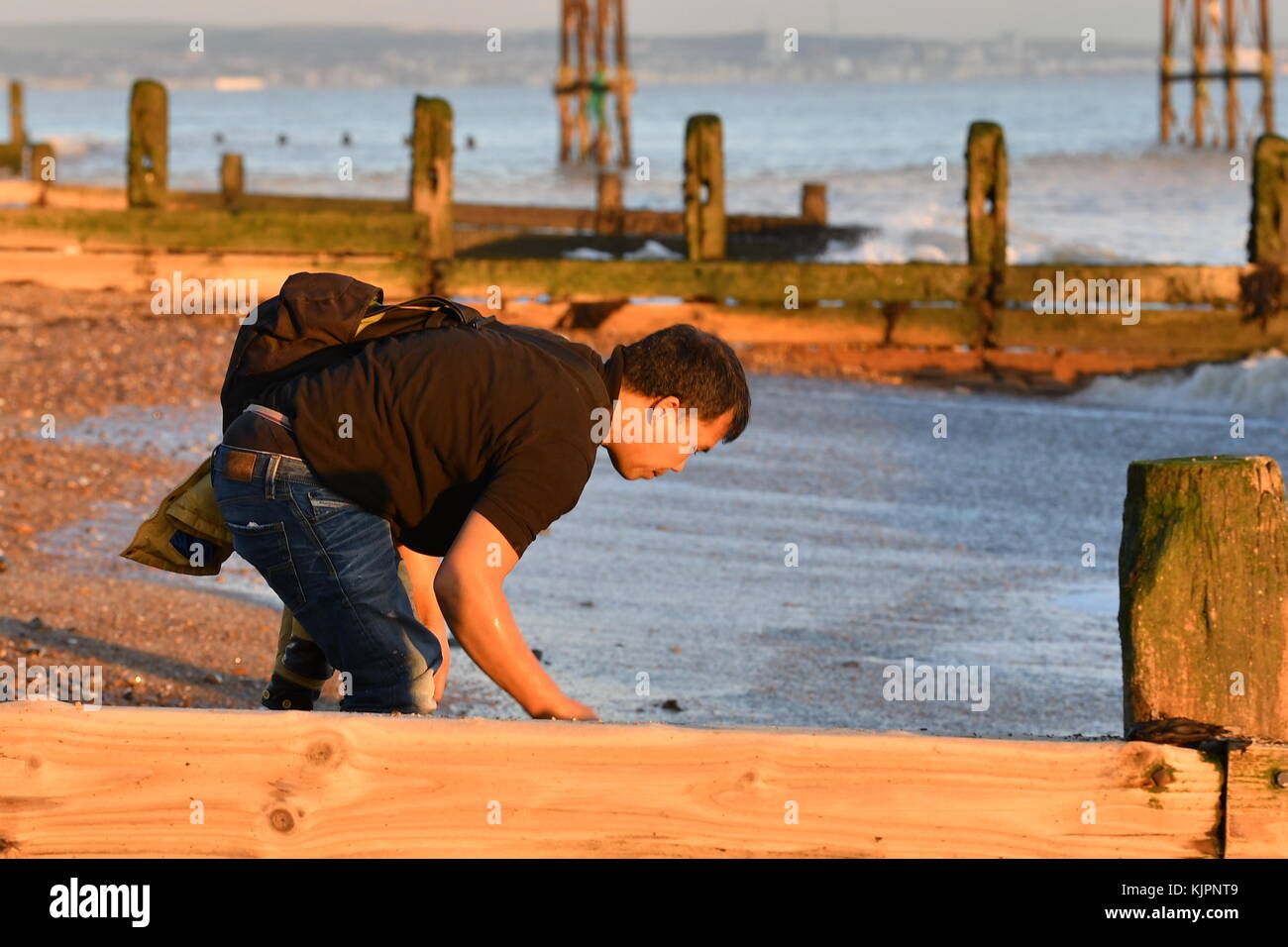 Man washing himself with sea water Stock Photo - Alamy