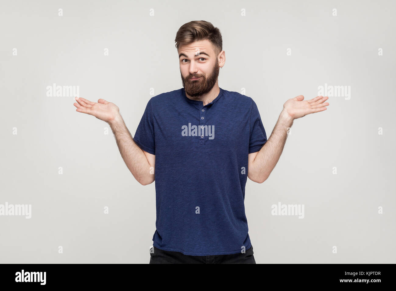 Who knows. It's not me. Puzzled man not sure. Studio shot Stock Photo ...