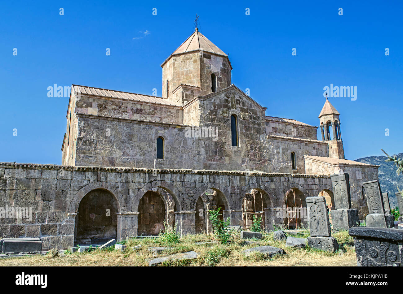 Side view of the monastery Odzun and medieval cemetery with basalt ...