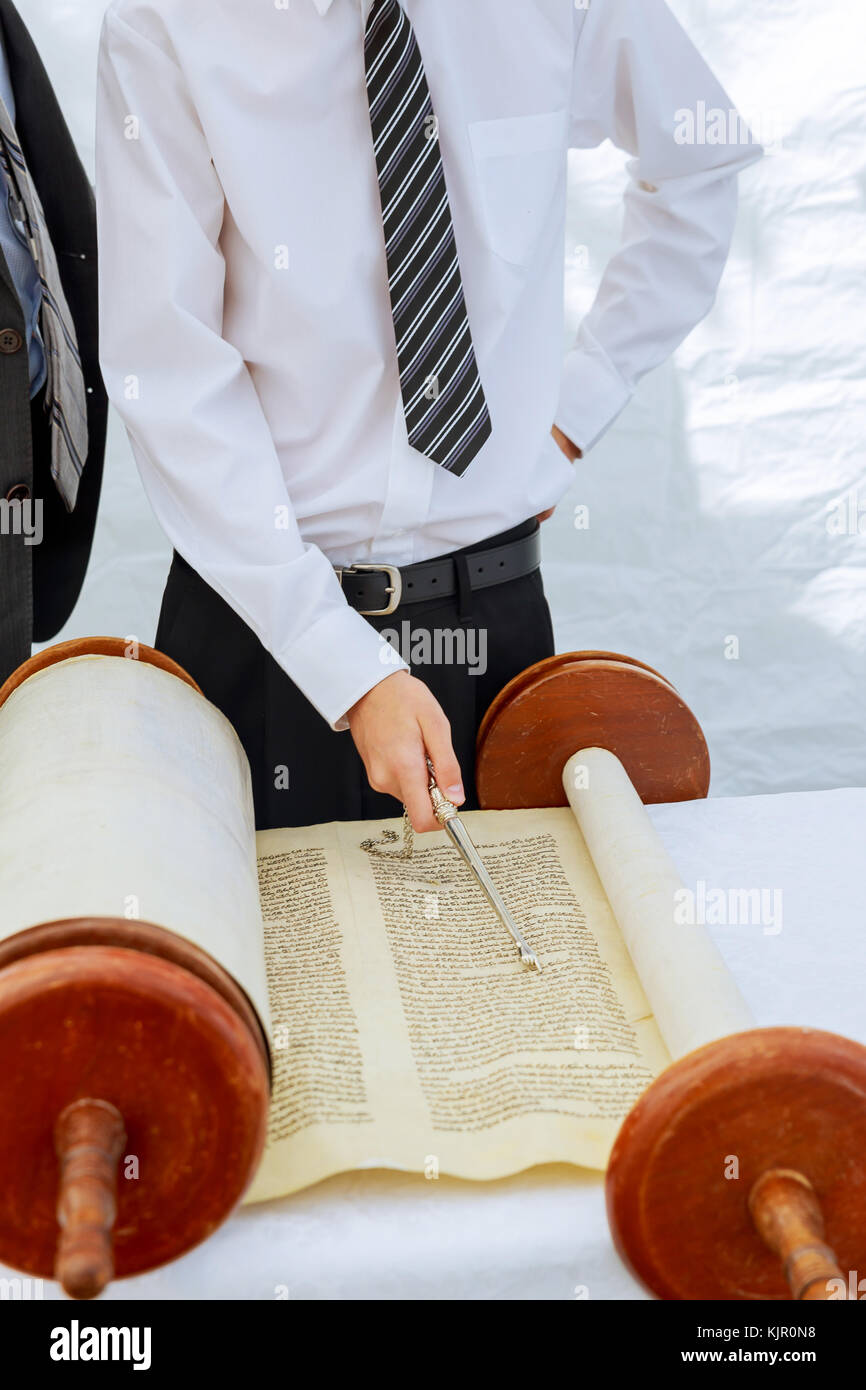 Hand of boy reading the Jewish Torah at Bar Mitzvah Bar Mitzvah Torah ...