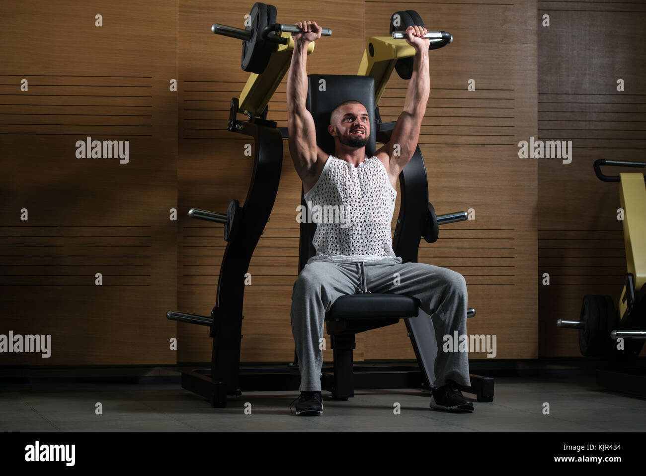 Handsome Muscular Fitness Bodybuilder Doing Heavy Weight Exercise For ...