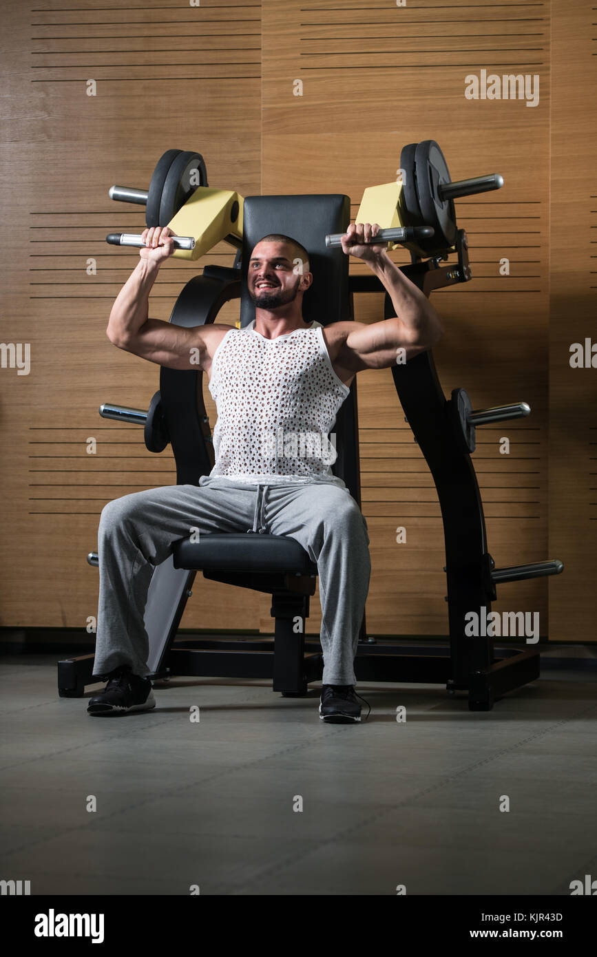 Handsome Muscular Fitness Bodybuilder Doing Heavy Weight Exercise For ...