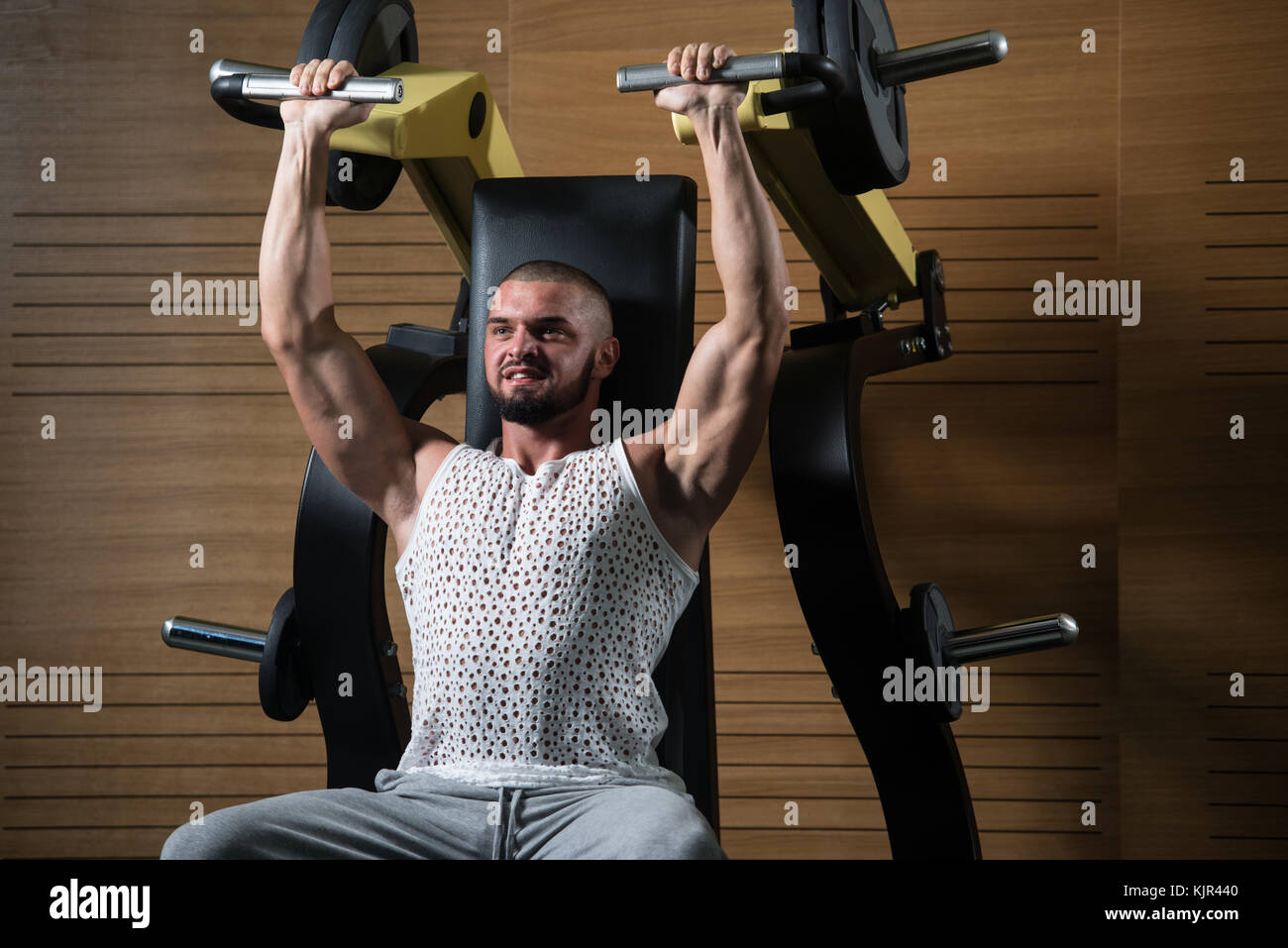 Handsome Muscular Fitness Bodybuilder Doing Heavy Weight Exercise For ...