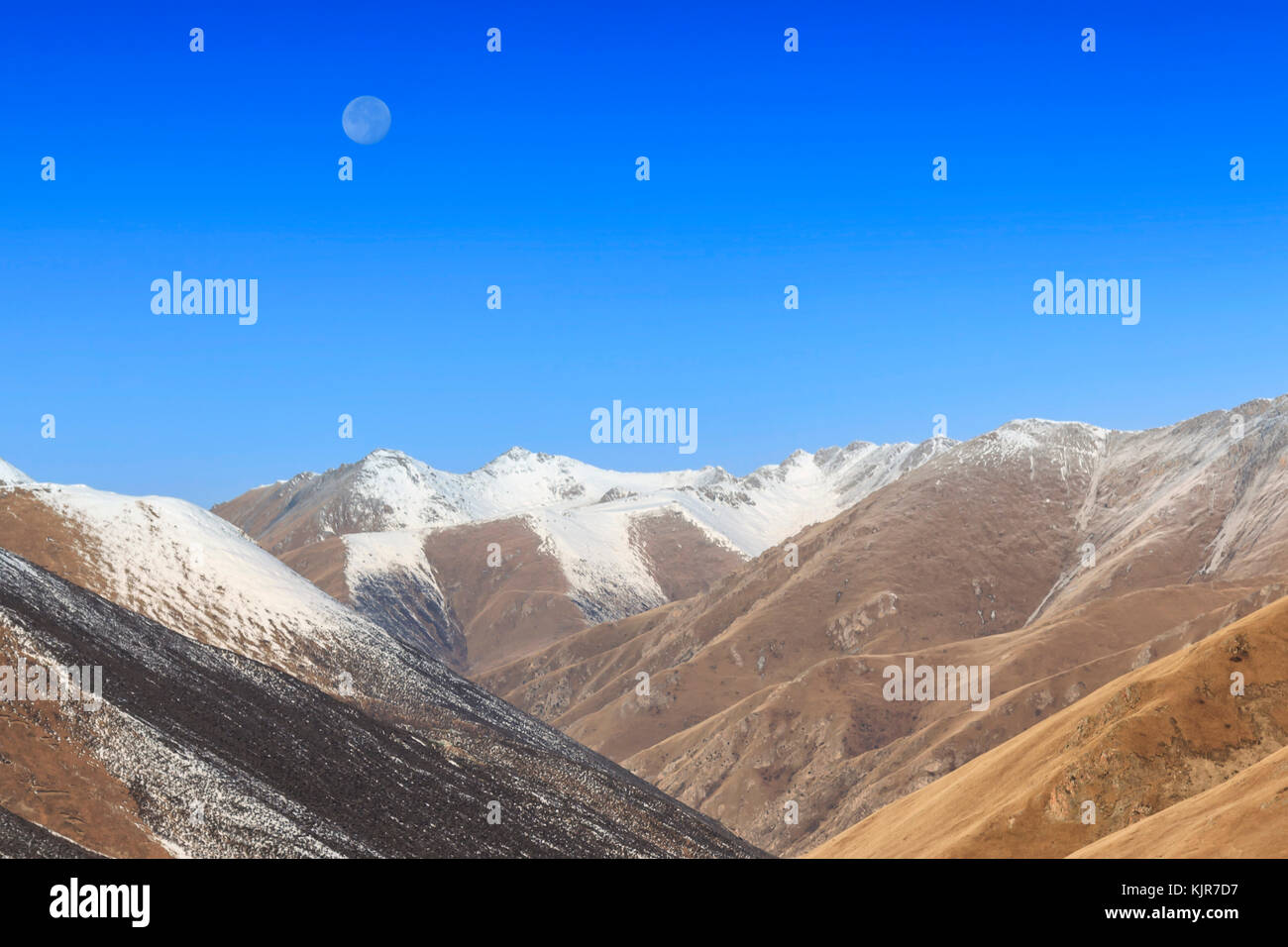 Moon rising over Mountain Tibetan Himalayan landscape in SiChuan ...