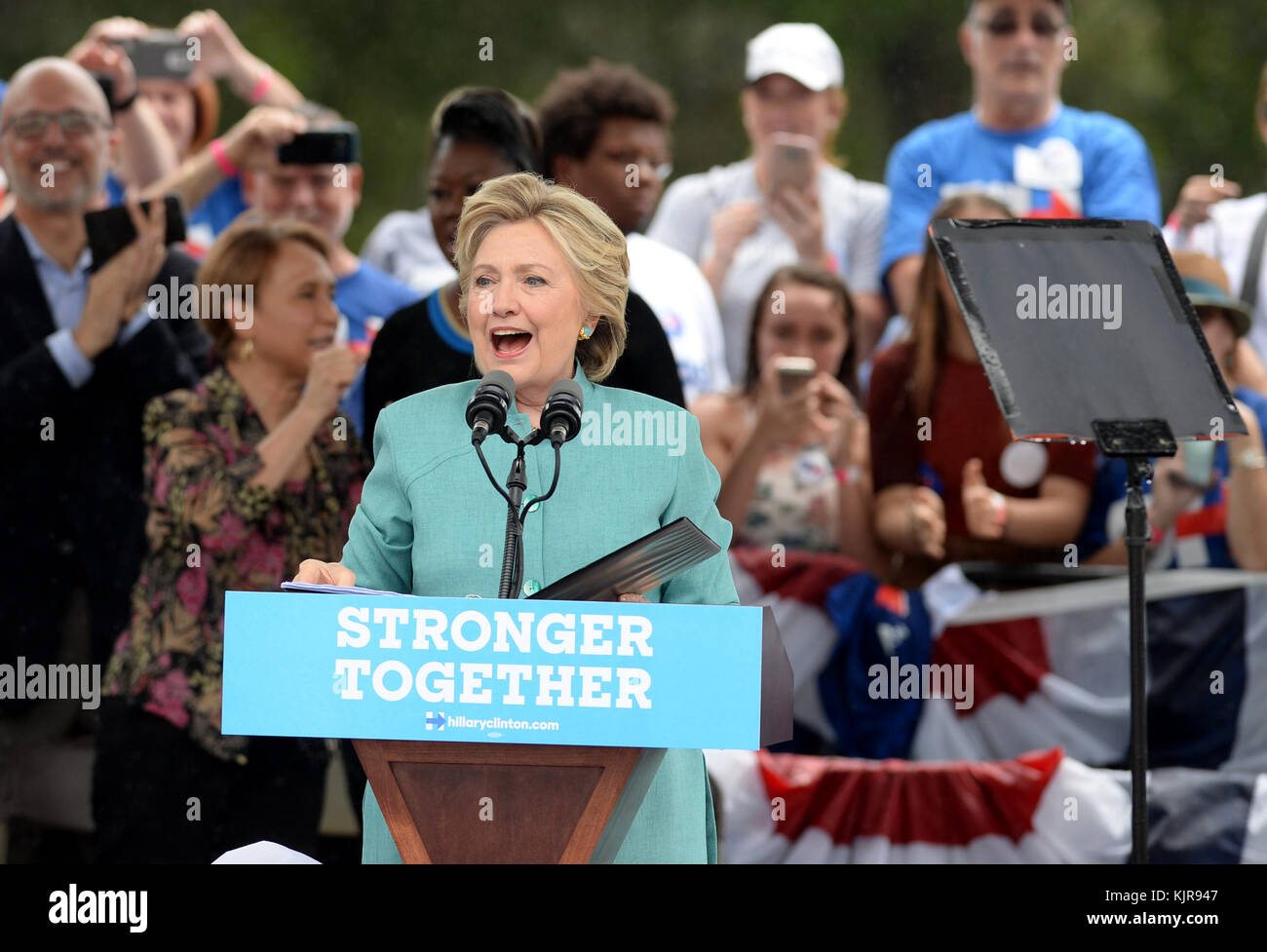 PEMBROKE PINES, FL - NOVEMBER 05: Supporters look in the pouring rain ...