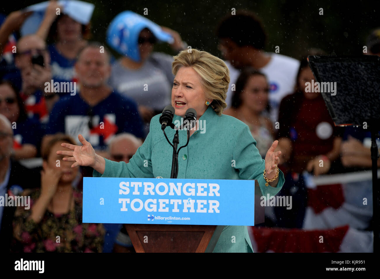 PEMBROKE PINES, FL - NOVEMBER 05: Supporters look in the pouring rain ...