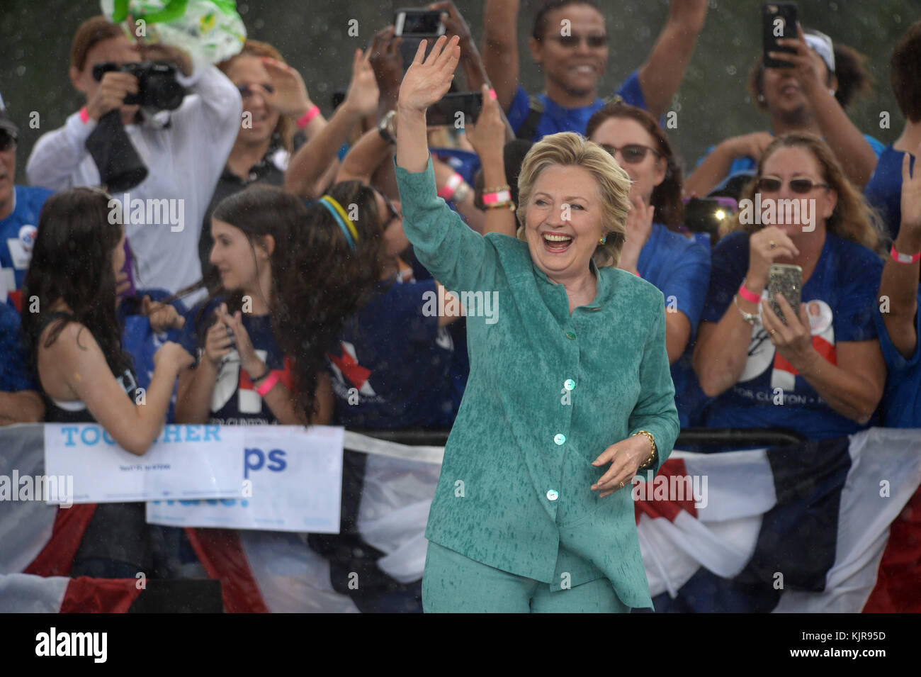 PEMBROKE PINES, FL - NOVEMBER 05: Supporters look in the pouring rain ...