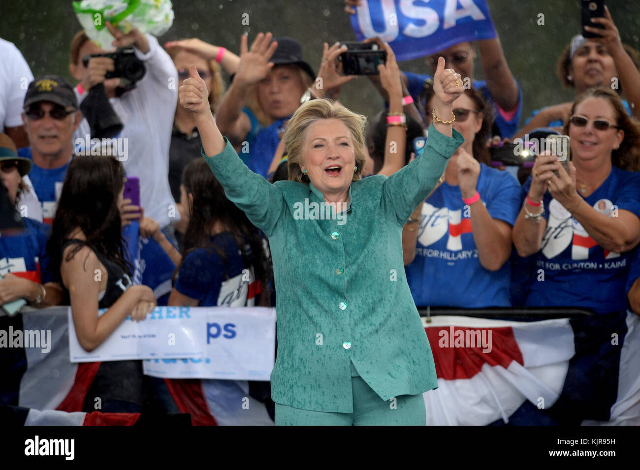 PEMBROKE PINES, FL - NOVEMBER 05: Supporters look in the pouring rain ...