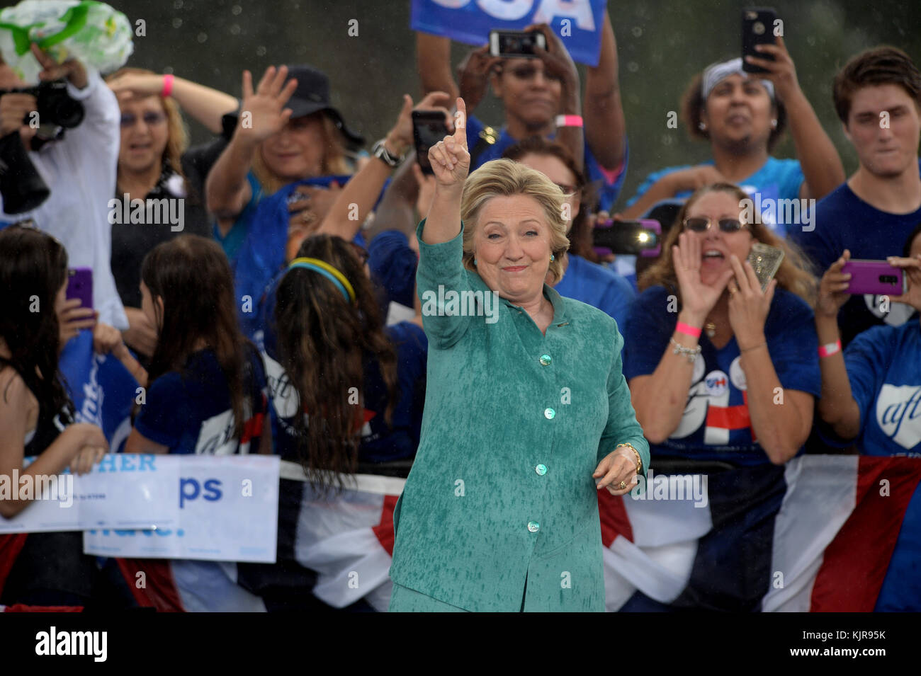 PEMBROKE PINES, FL - NOVEMBER 05: Supporters look in the pouring rain ...
