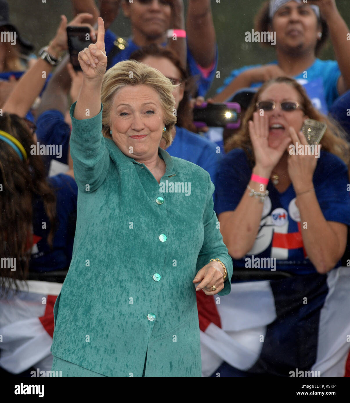 PEMBROKE PINES, FL - NOVEMBER 05: Supporters look in the pouring rain ...