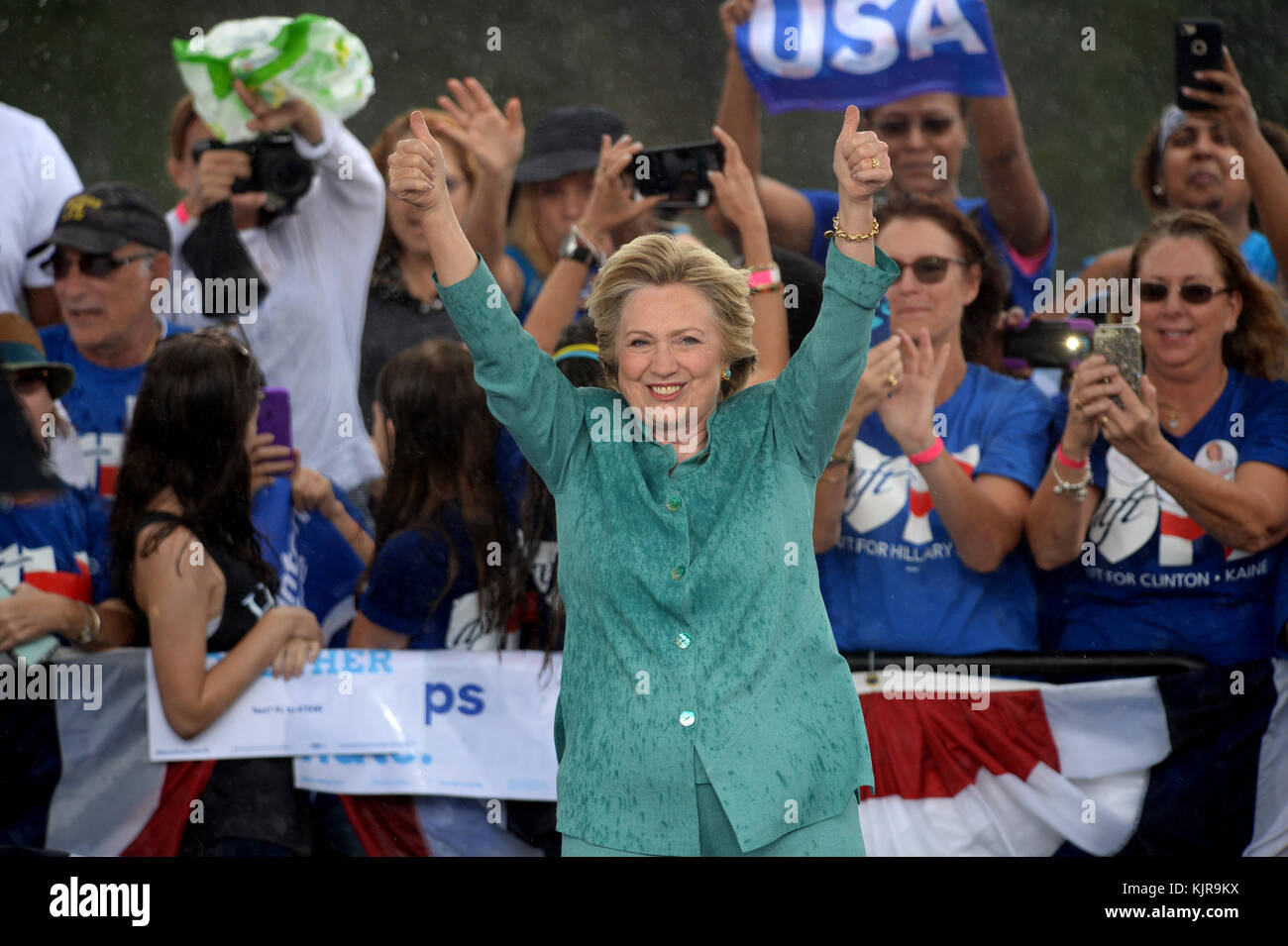 PEMBROKE PINES, FL - NOVEMBER 05: Supporters look in the pouring rain ...