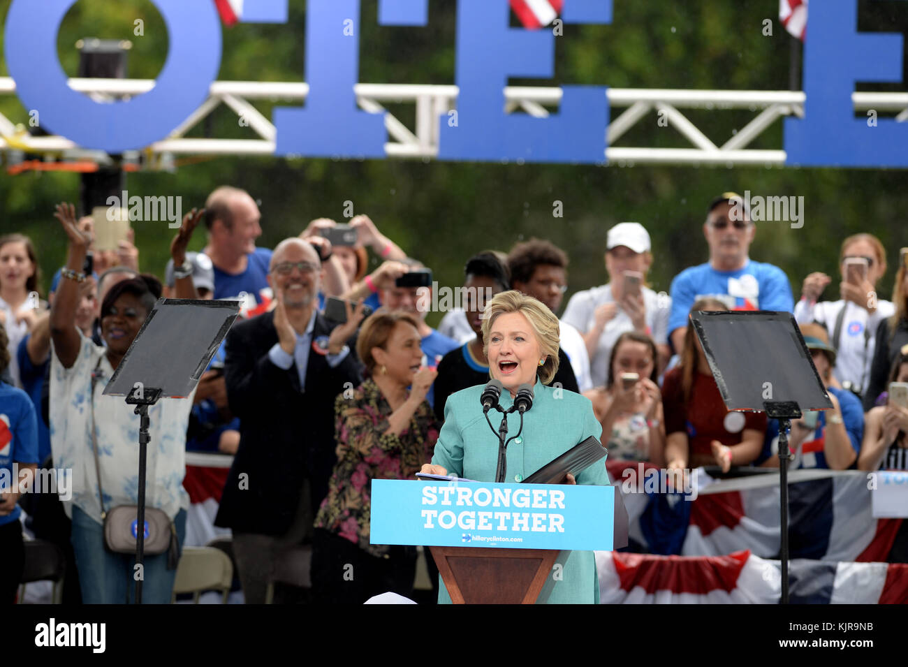 PEMBROKE PINES, FL - NOVEMBER 05: Supporters look in the pouring rain ...
