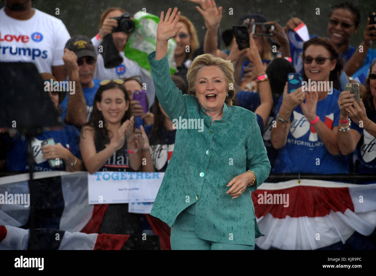 PEMBROKE PINES, FL - NOVEMBER 05: Supporters look in the pouring rain ...