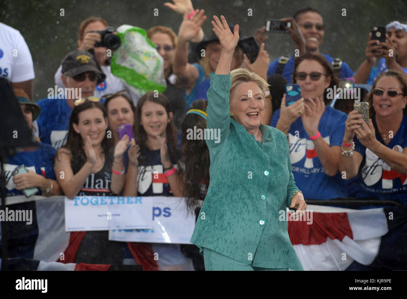 PEMBROKE PINES, FL - NOVEMBER 05: Supporters look in the pouring rain ...