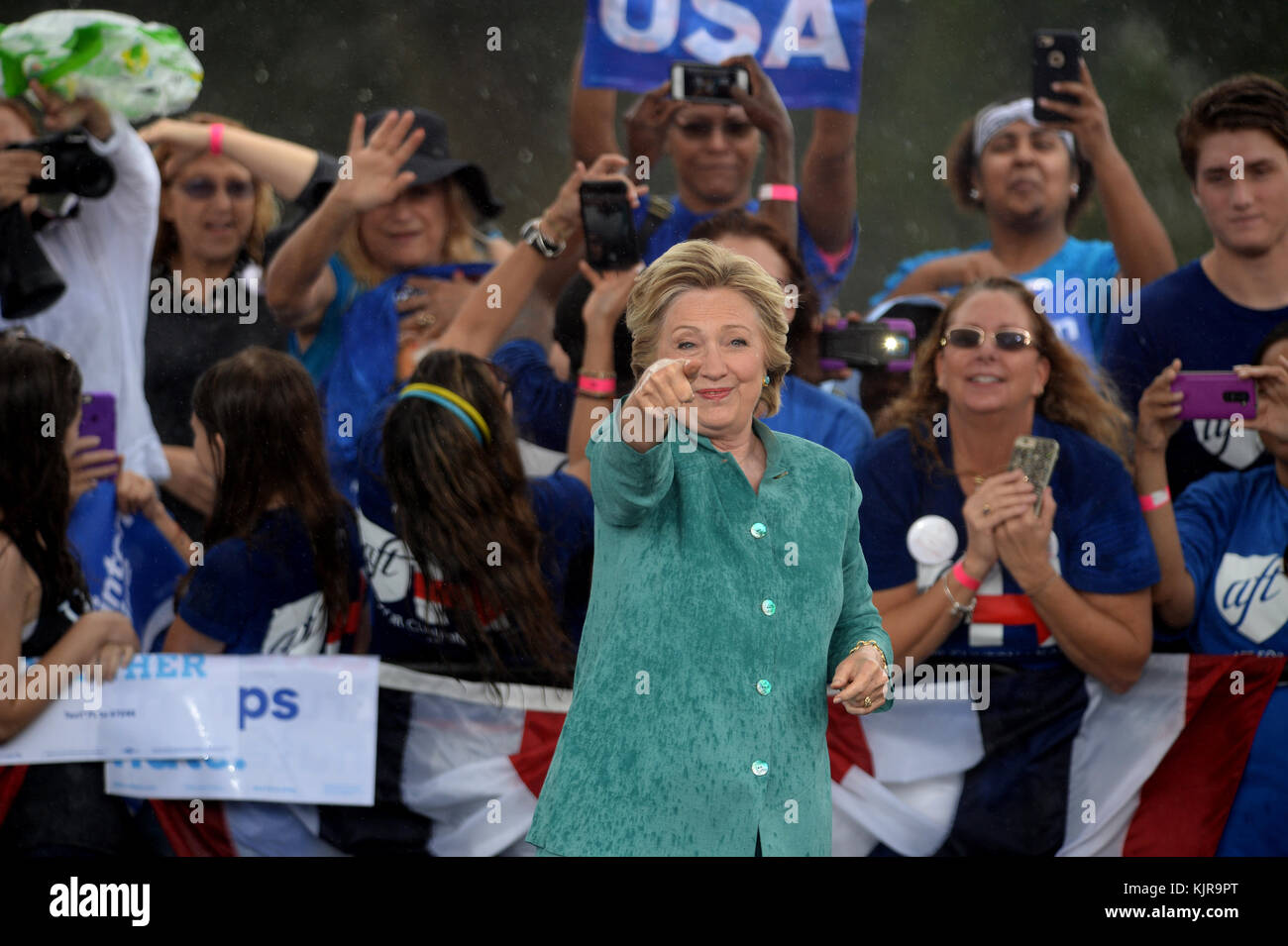 PEMBROKE PINES, FL - NOVEMBER 05: Supporters look in the pouring rain ...