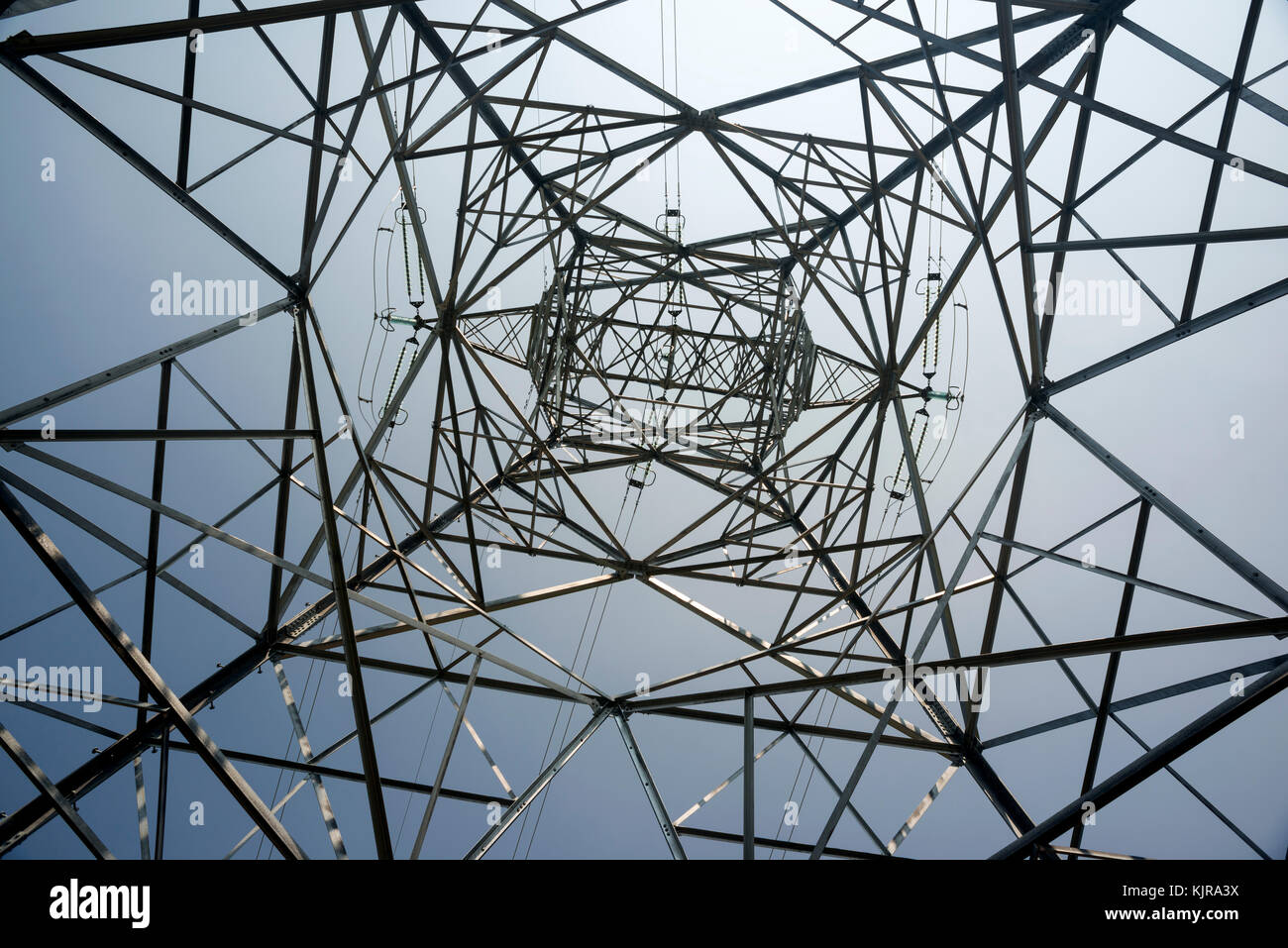 A high tension power line as seen from below looking upward Stock Photo ...