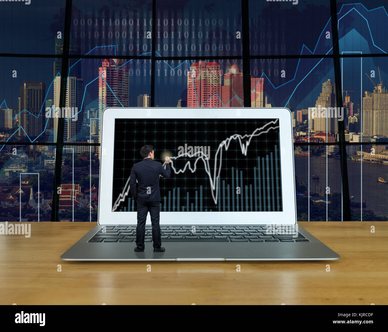 Businessman standing over the computer laptop on the wood table and ...