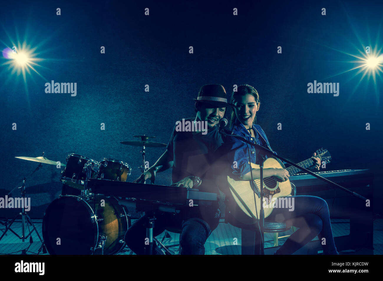 Musician duo band singing a song and playing music instrument with ...