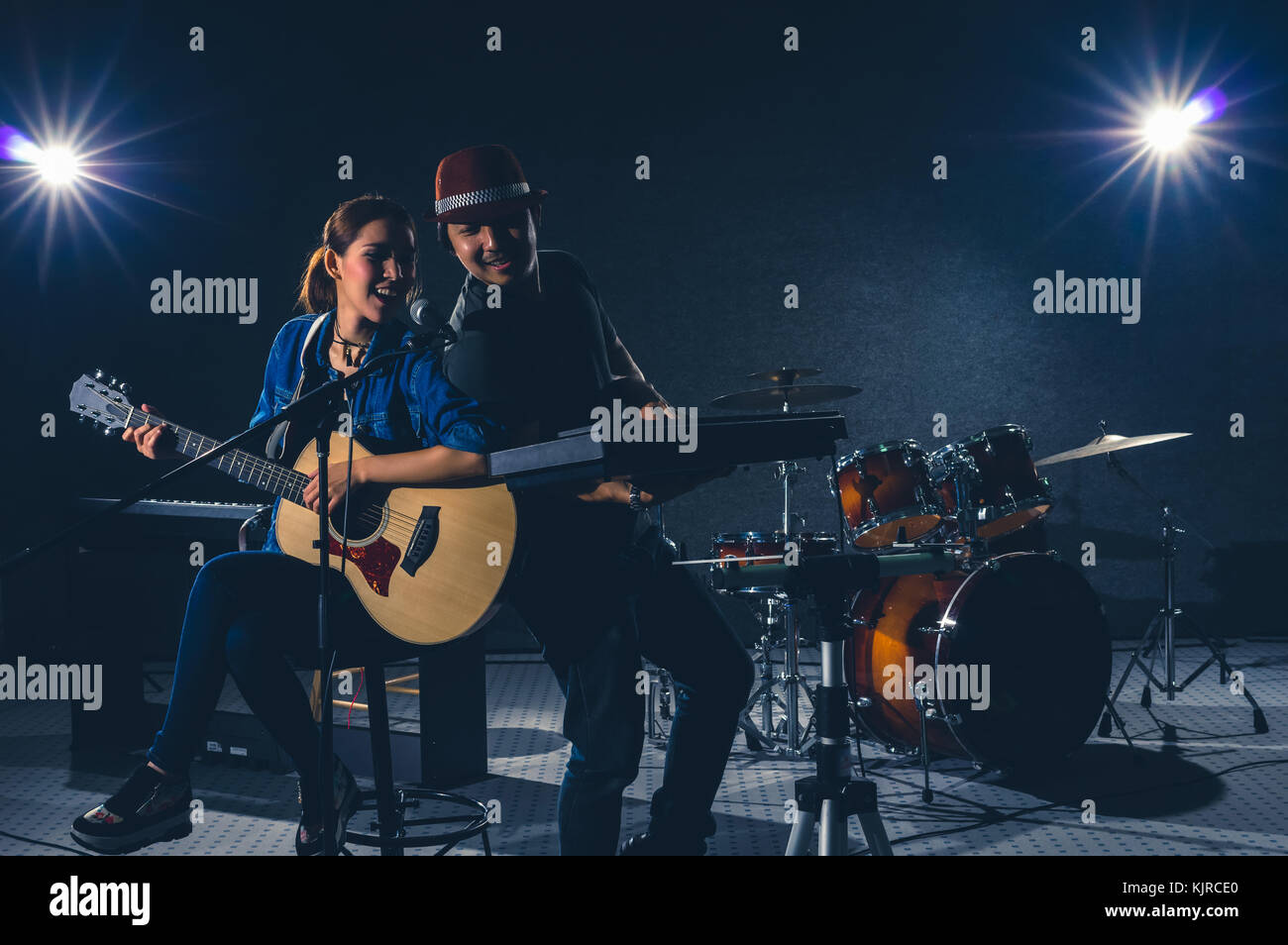 Musician duo band singing a song and playing music instrument with ...