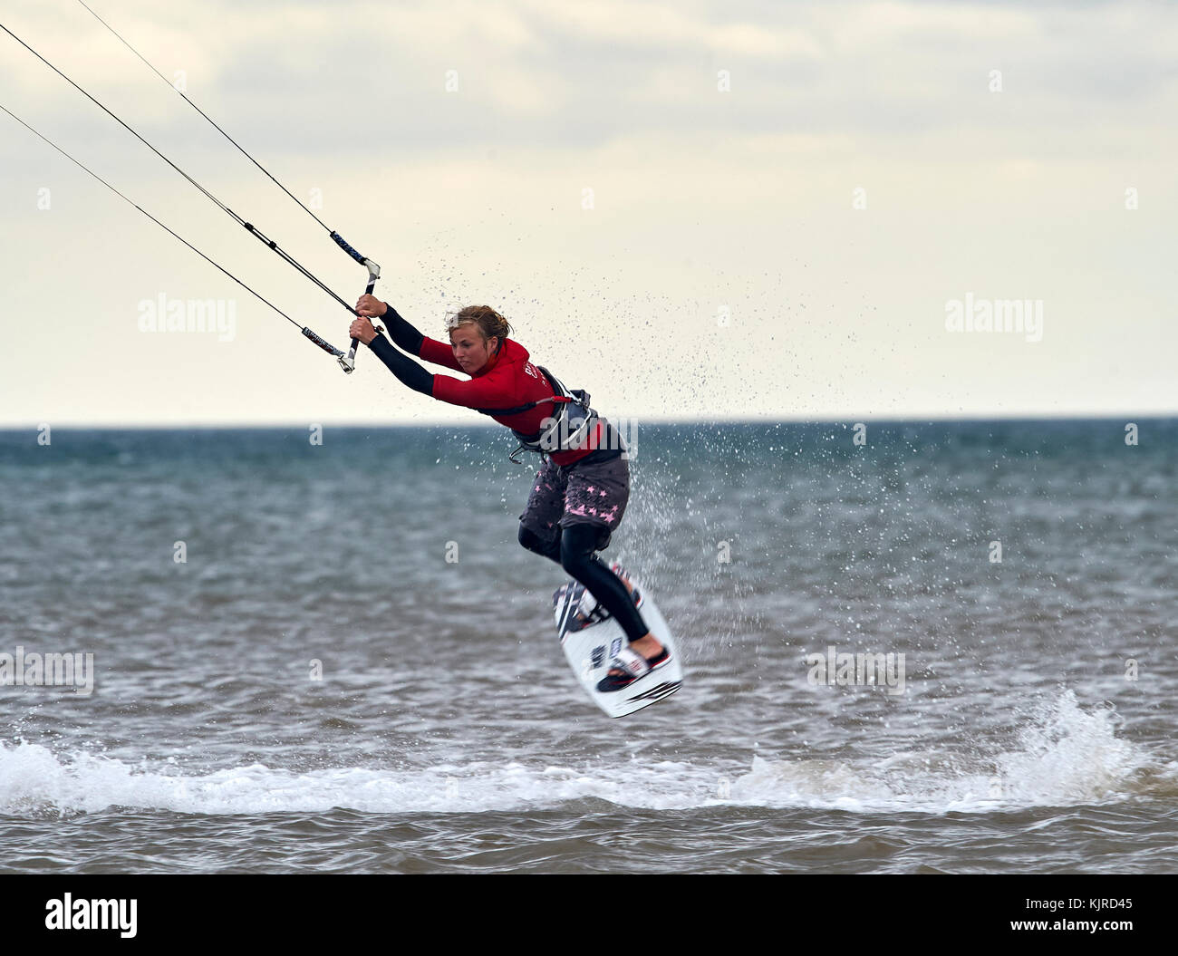 Kitesurfer kitesurfing above ocean wave, Kitesurfing World ...