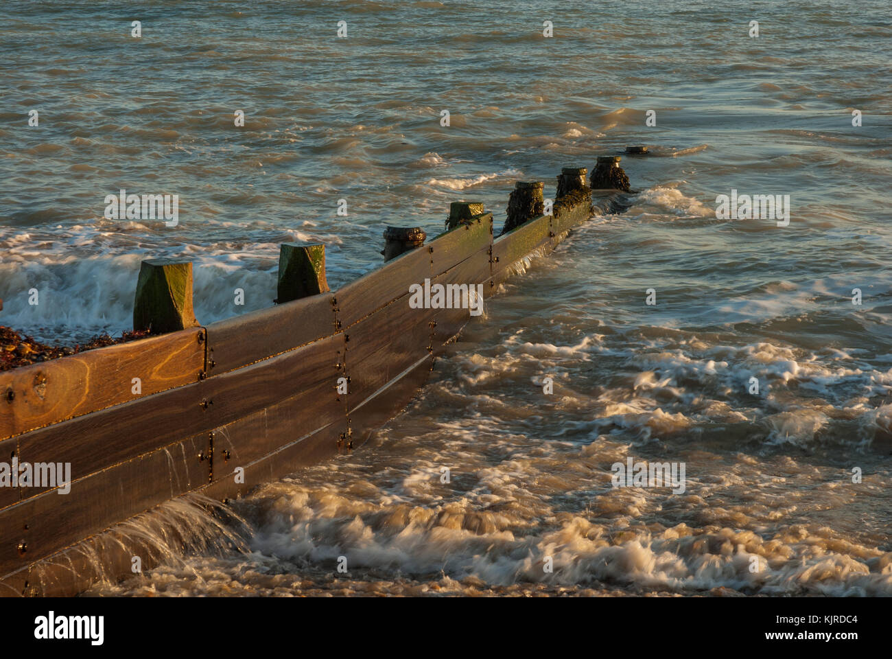 Wooden groynes at Elmer Sands pebble beach in West Sussex Stock Photo ...