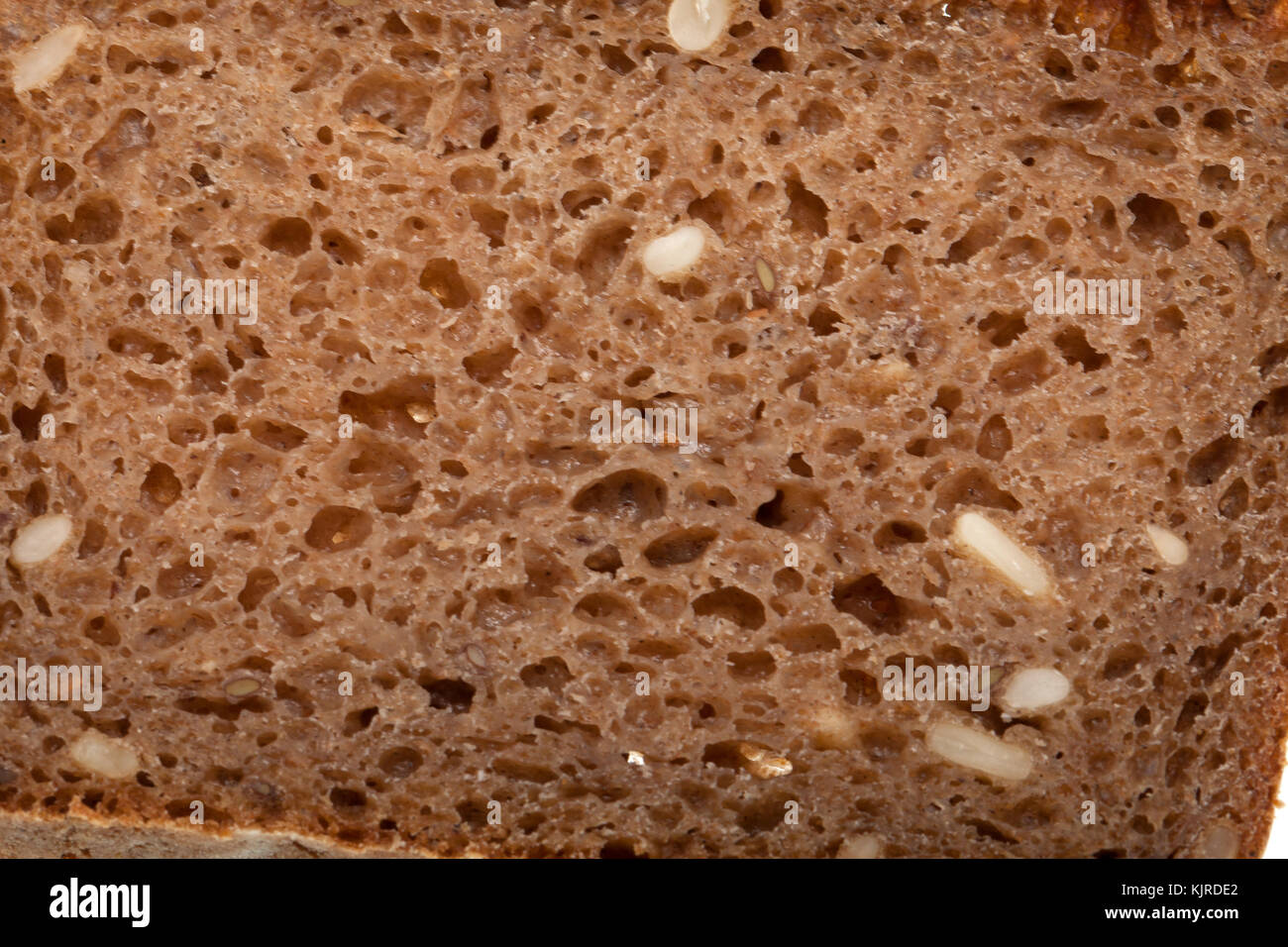 Slice of dark bread isolated over white Stock Photo - Alamy