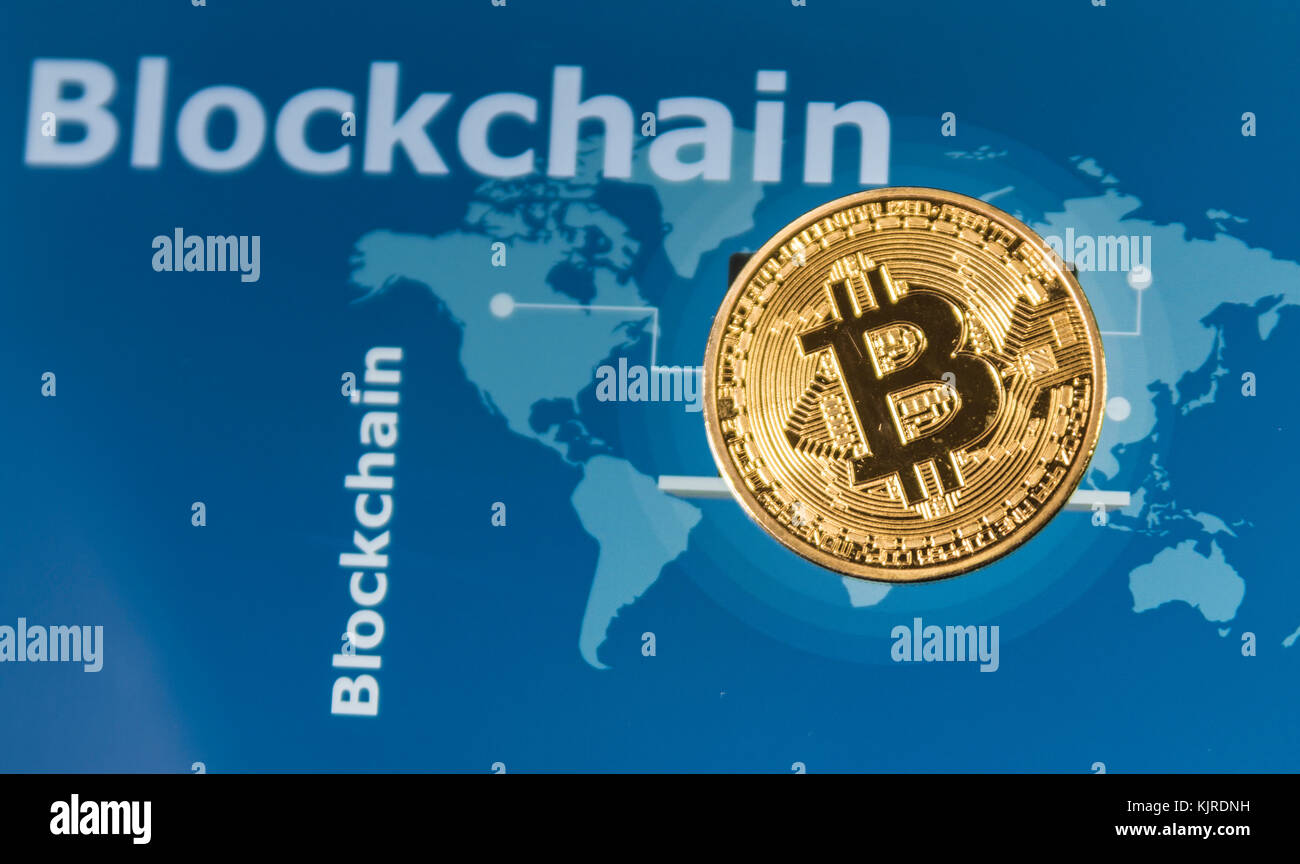 Bitcoin over a screen with blockchain word.Closed cryptocurrency and ...