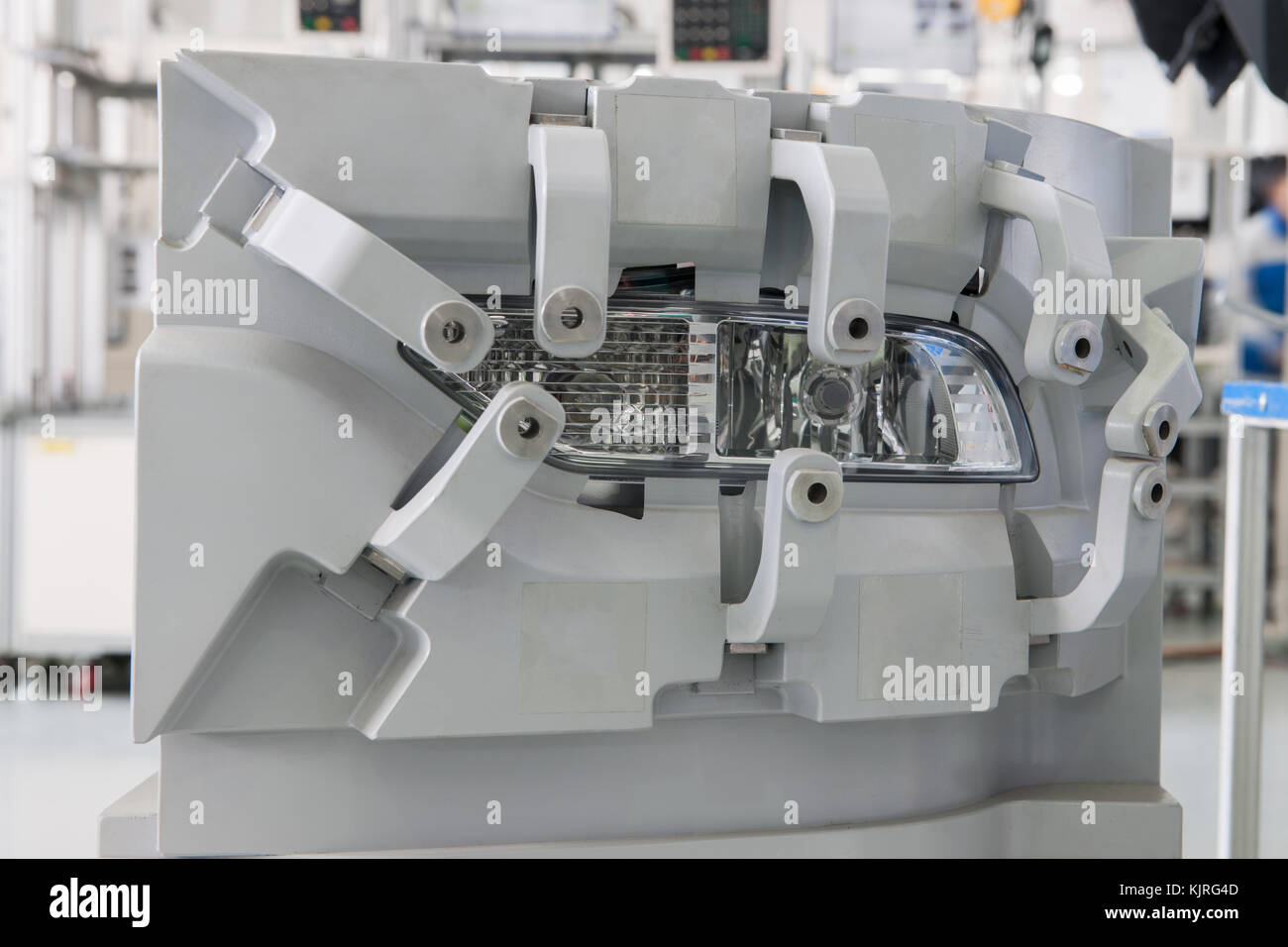 close-up factory equipment of quality control of car headlight. testing ...