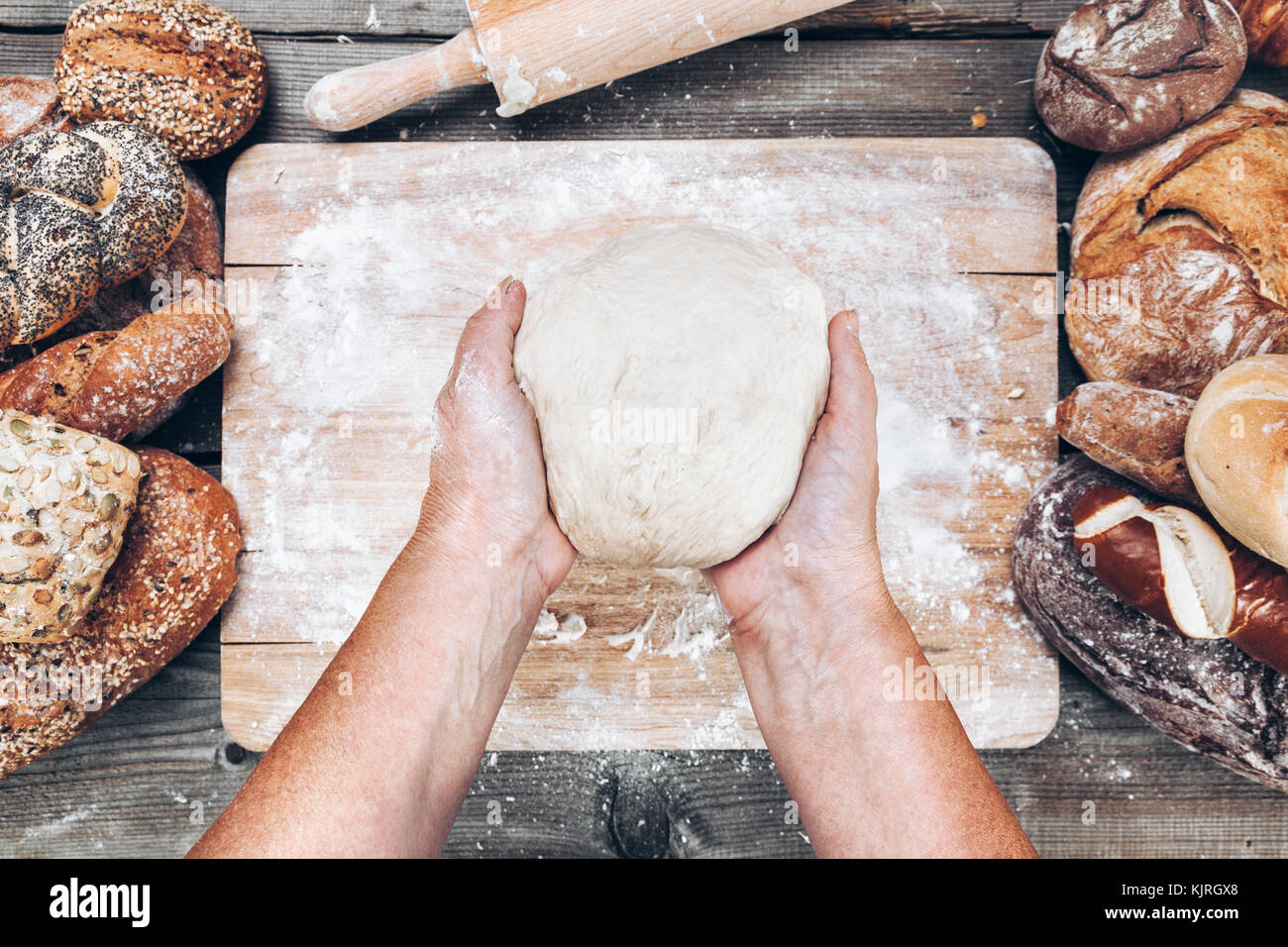 Baker preparing a variety delicious fresh bread and pastry Stock Photo ...