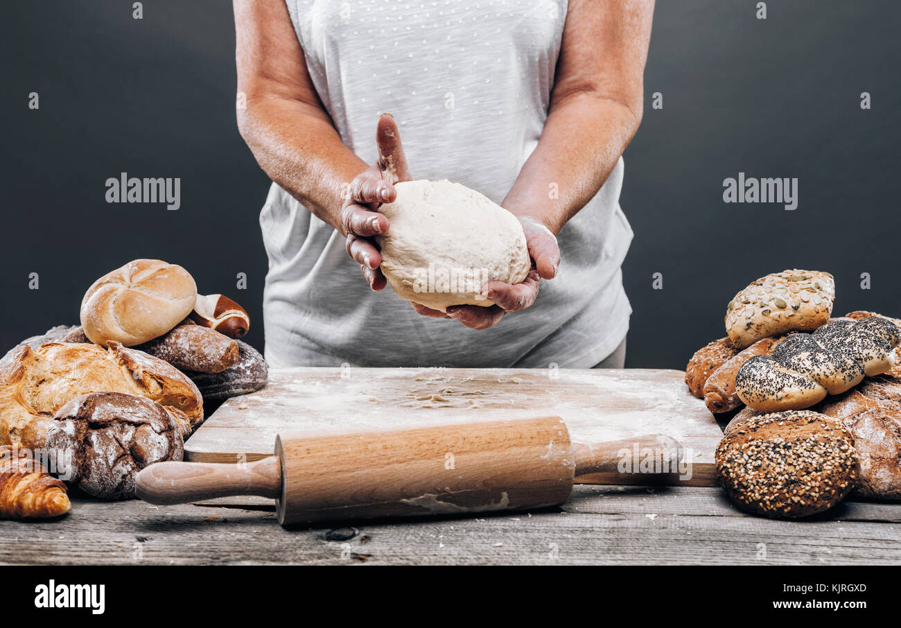 Baker preparing a variety delicious fresh bread and pastry Stock Photo ...