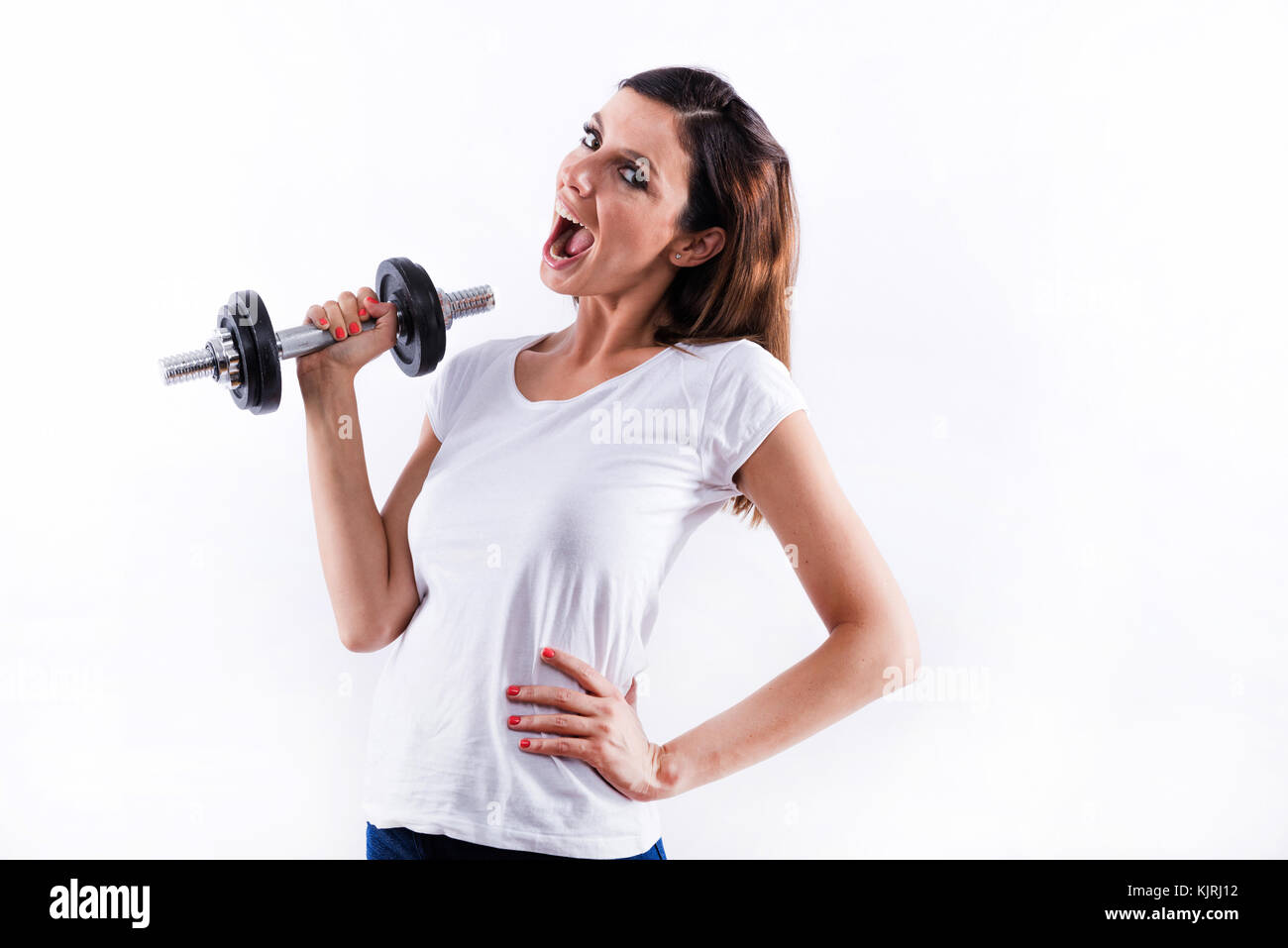 A beautiful young woman lifting weight and feeling happy Stock Photo ...
