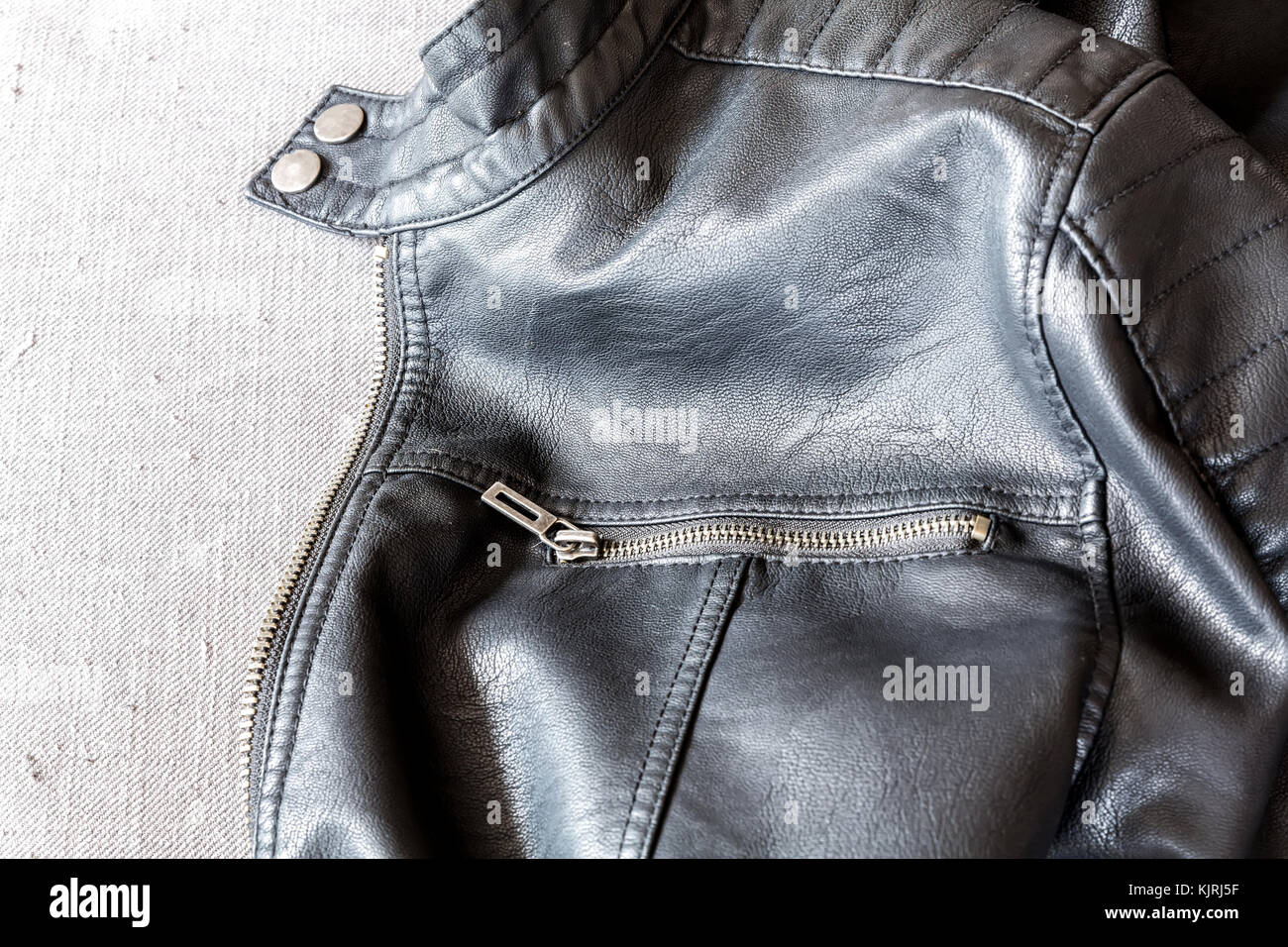 Stylish black leather jacket on the floor Stock Photo - Alamy