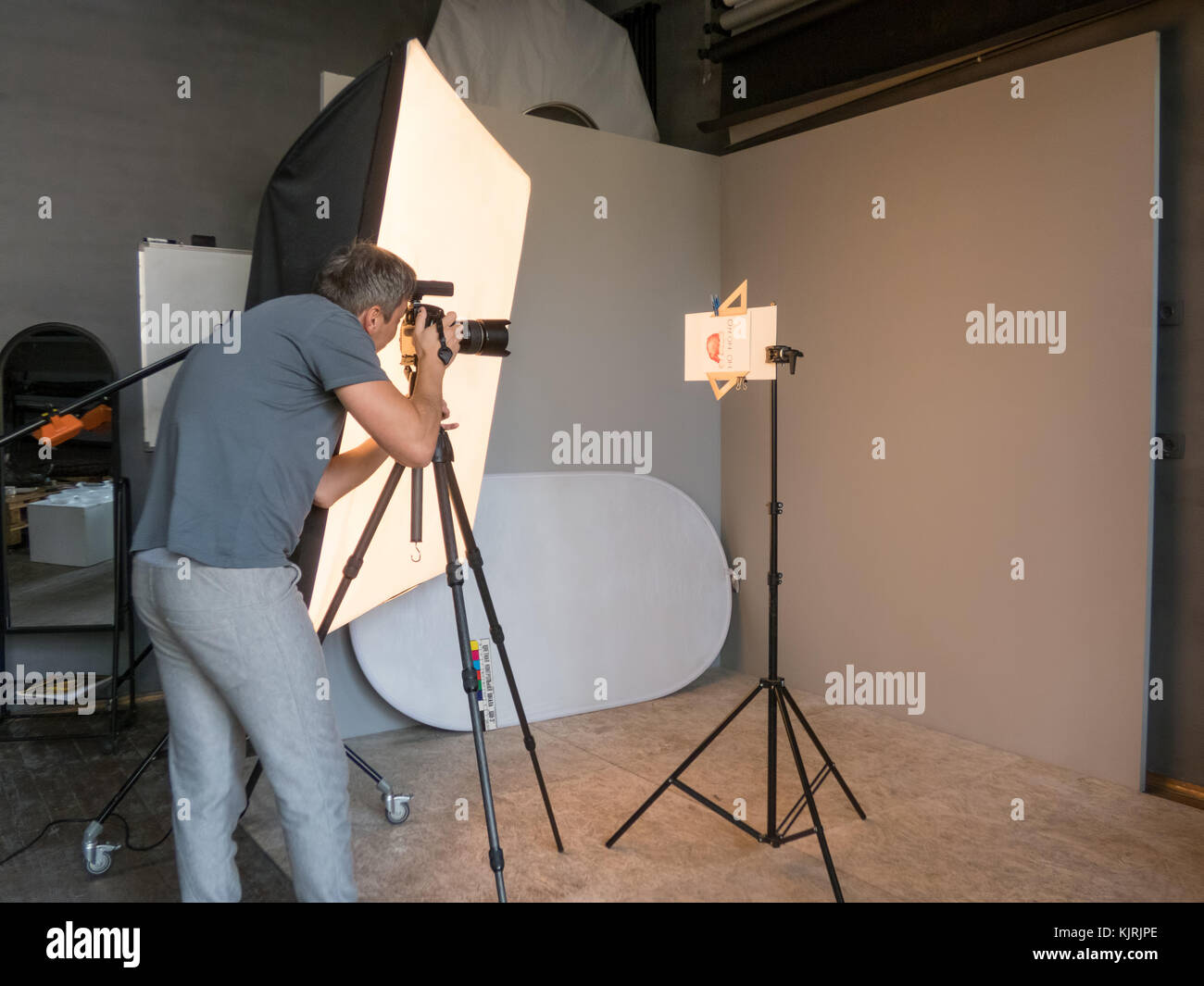 Young photographer working in photo studio hi-res stock photography and ...