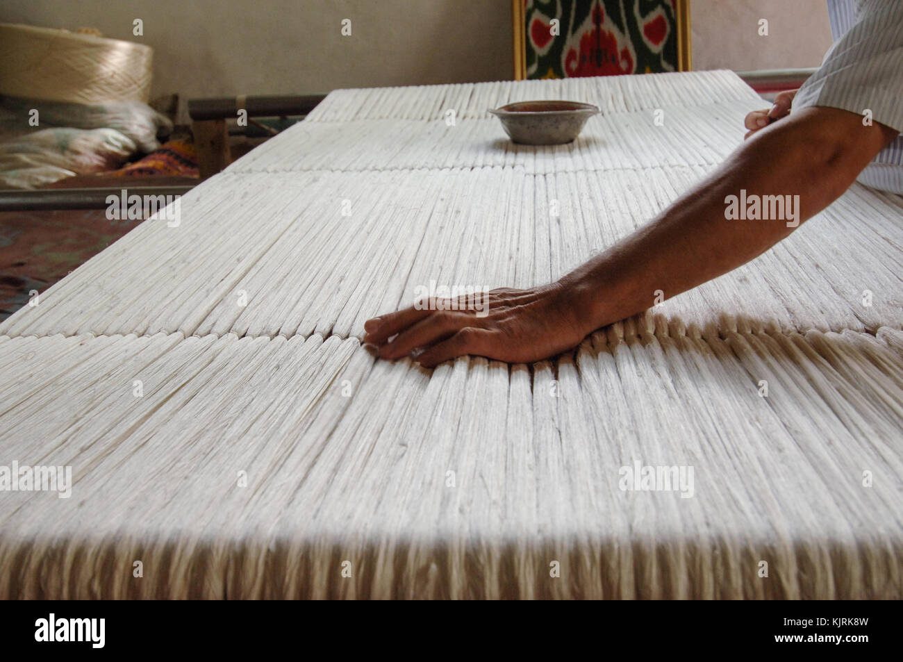 weaving and manufacturing of handmade carpets closeup Stock Photo - Alamy