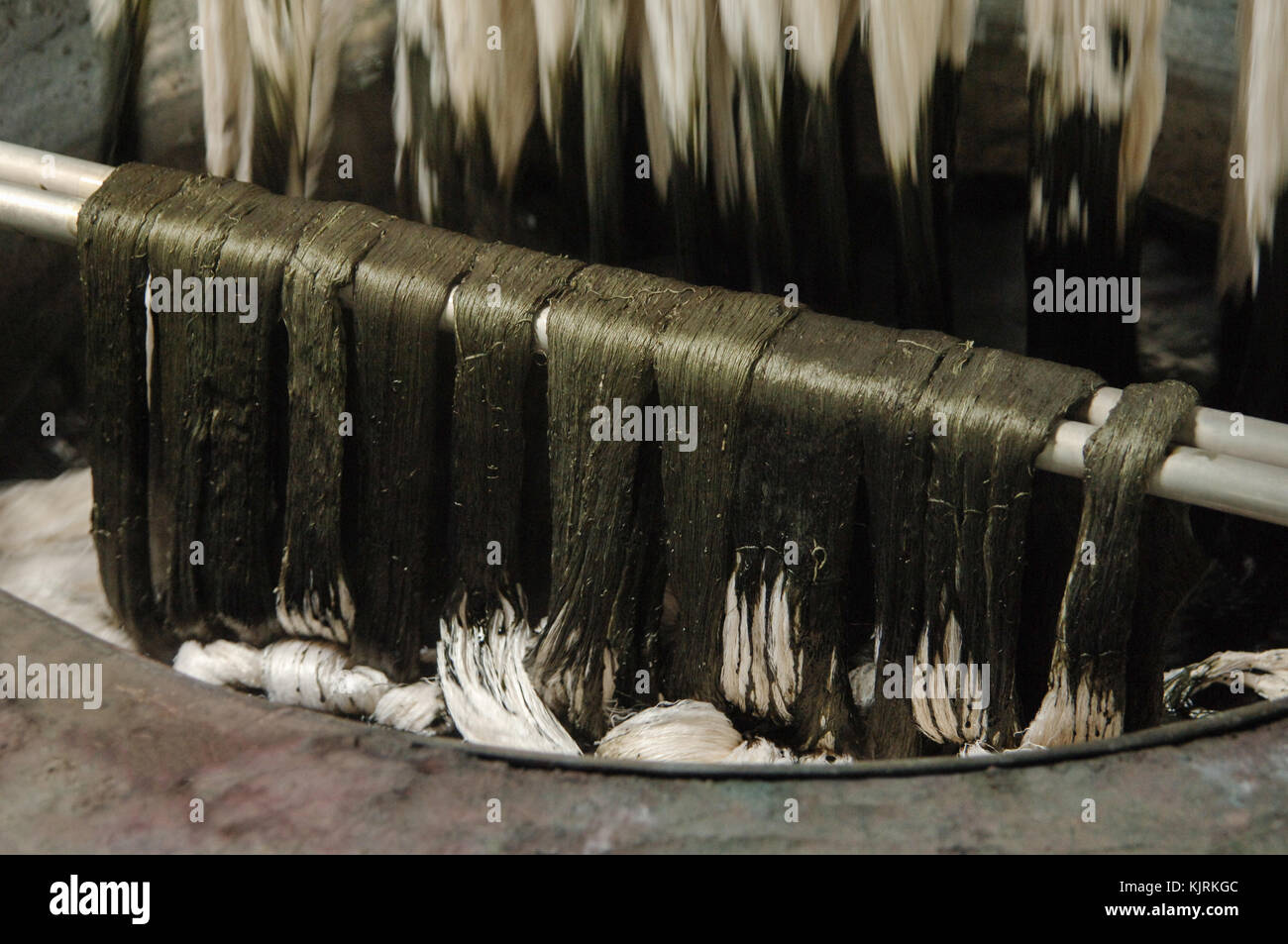 painting threads and yarns. dyeing of finished yarn Stock Photo - Alamy