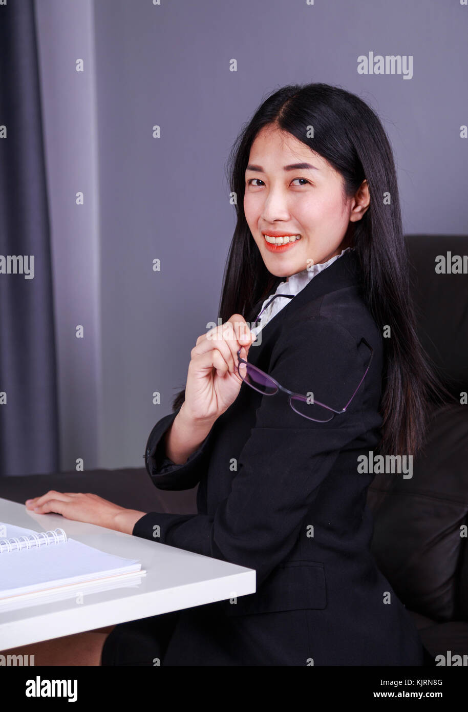 Attractive japanese woman sitting table hi-res stock photography and images - Alamy