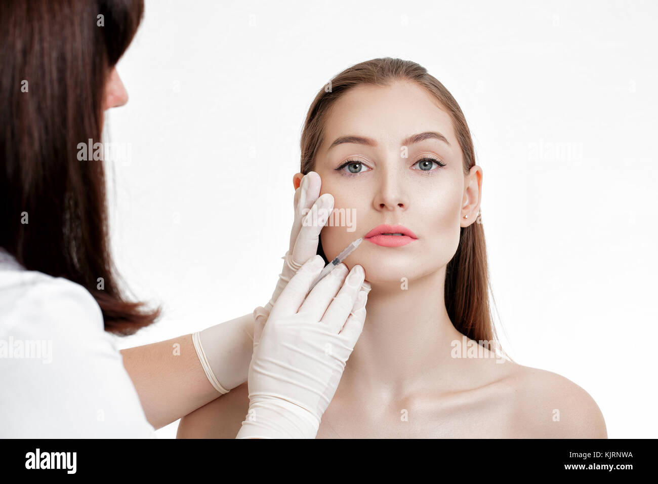 woman getting injection on lips Stock Photo - Alamy