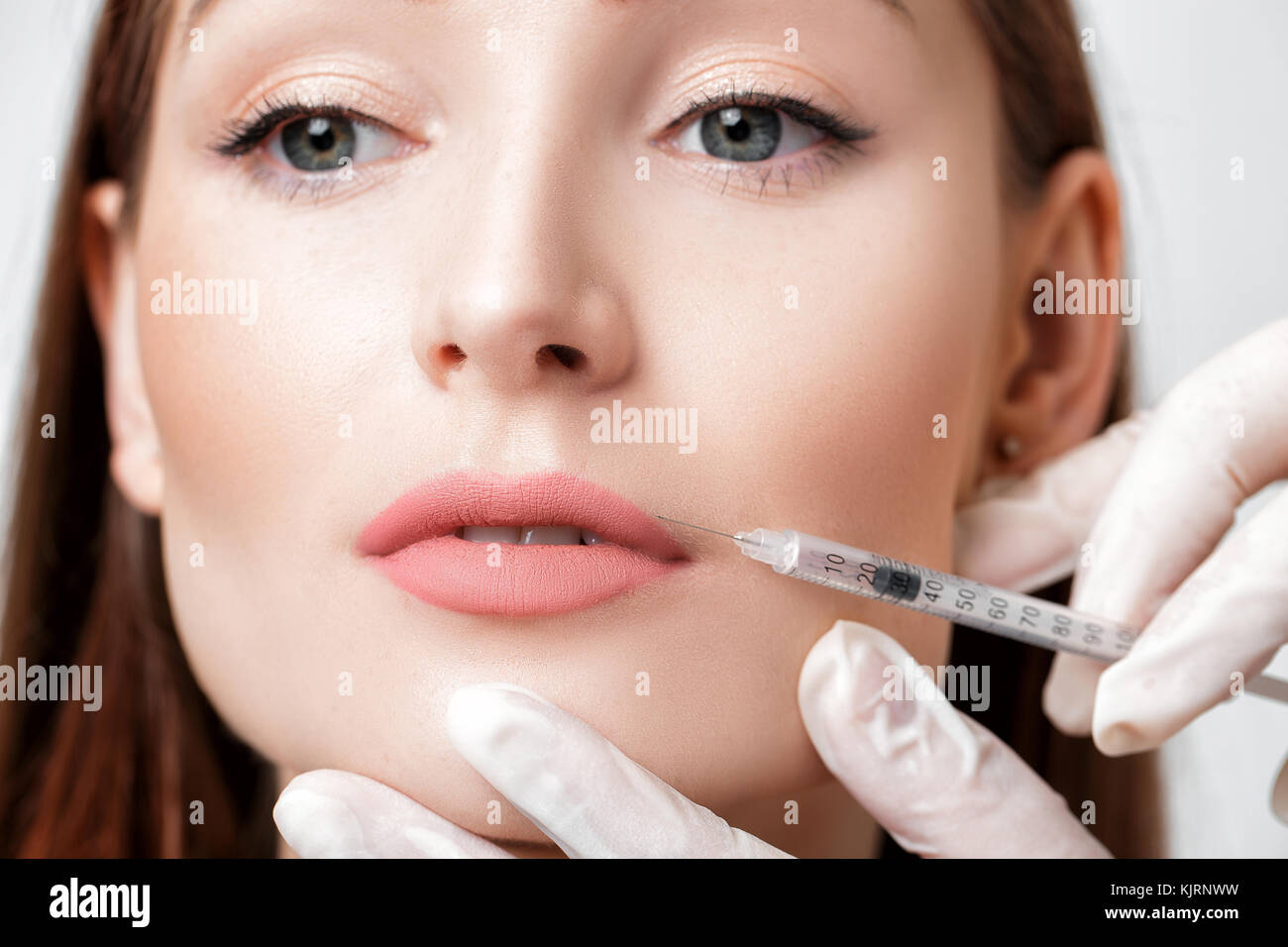 woman getting injection on lips Stock Photo - Alamy