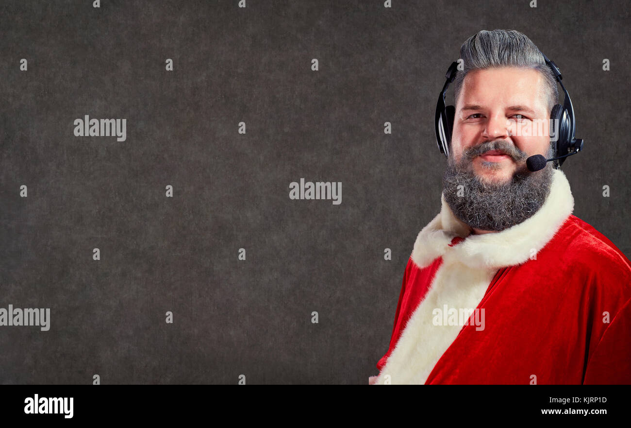 Santa Claus in a headset call center operator Stock Photo - Alamy