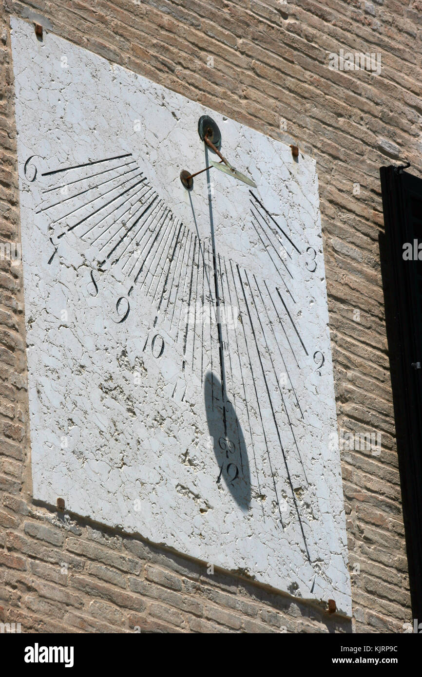 ancient sundial in the wall - Italy Stock Photo - Alamy