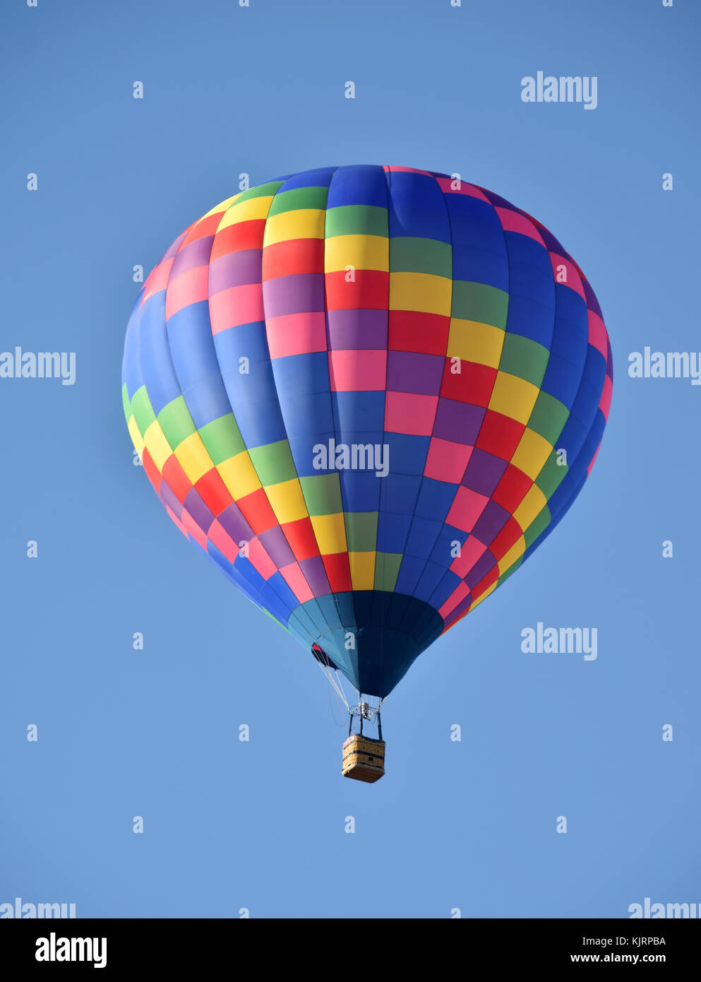 Colorful hot air balloon against blue sky Stock Photo - Alamy