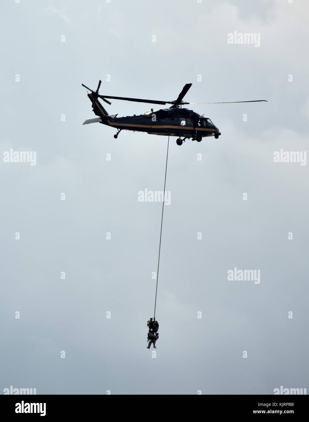 Helicopter performs emergency rescue airlift on outside rope Stock ...