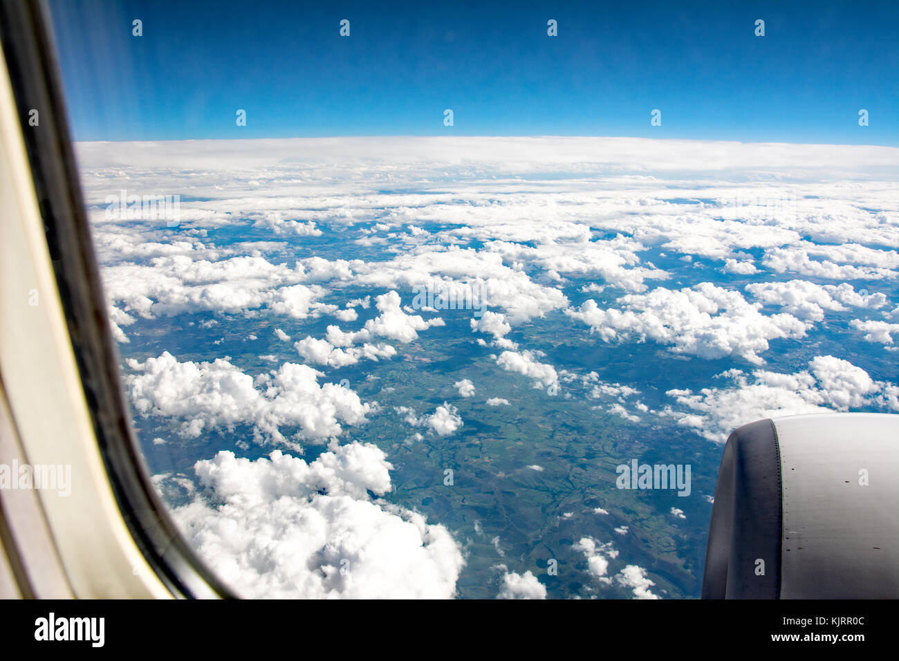 White clouds, the Earth and horizon viewed from a plane window Stock ...