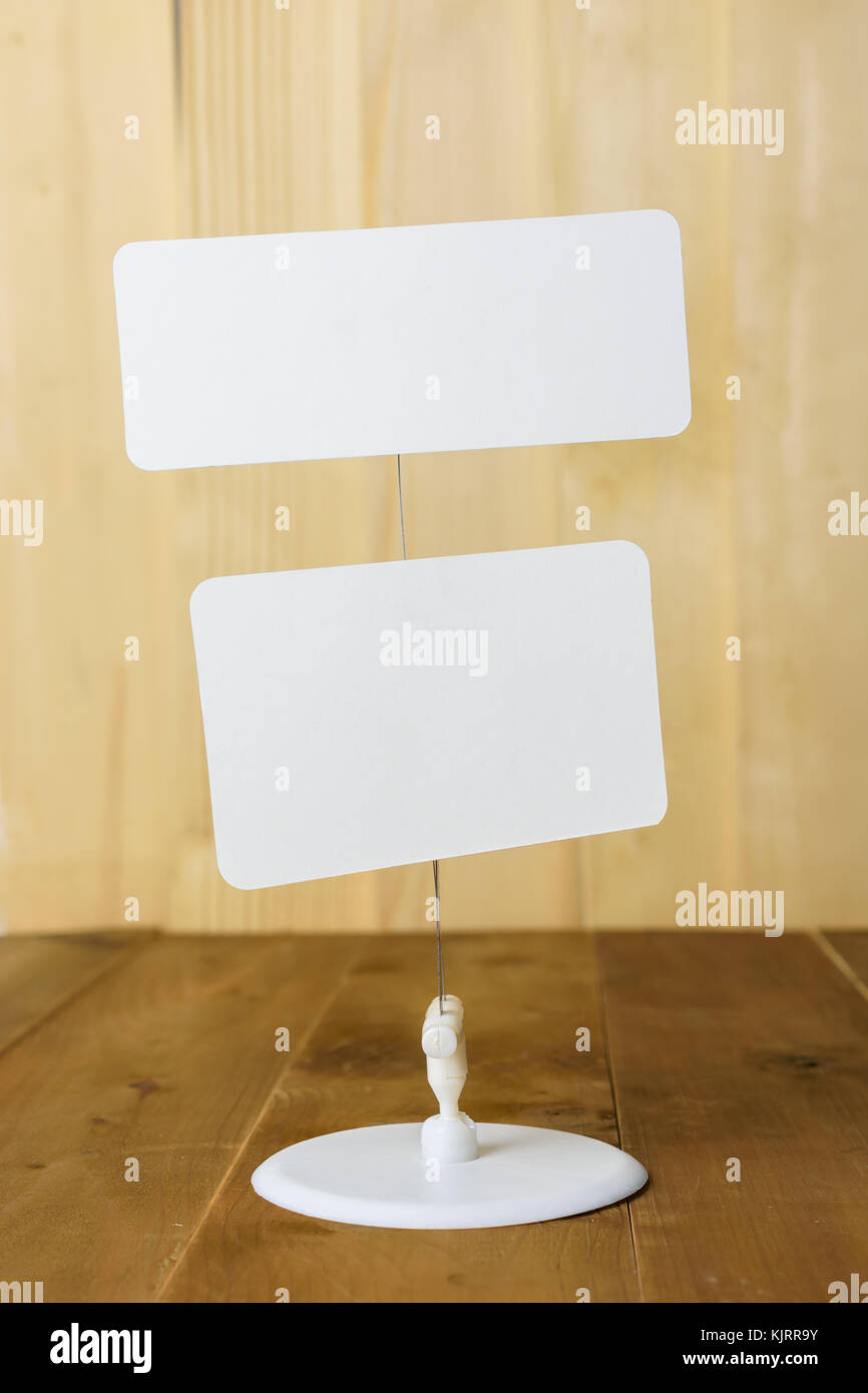 Double white label stand on the wooden table Stock Photo - Alamy