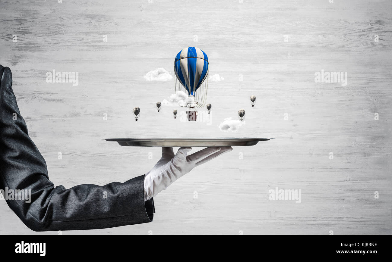 Hand of waitress presenting balloons on tray Stock Photo - Alamy