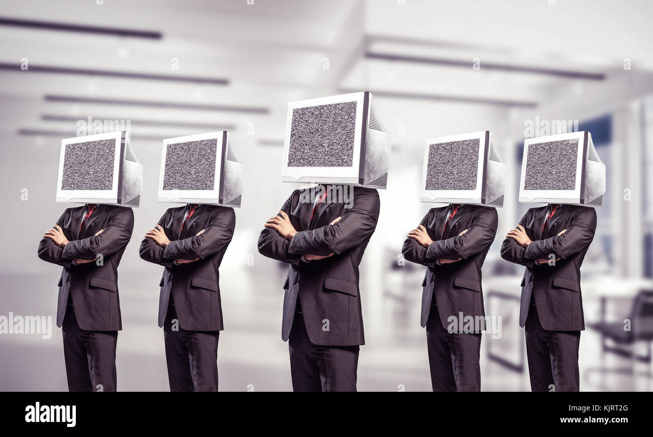 Businessmen with monitors instead of head Stock Photo - Alamy