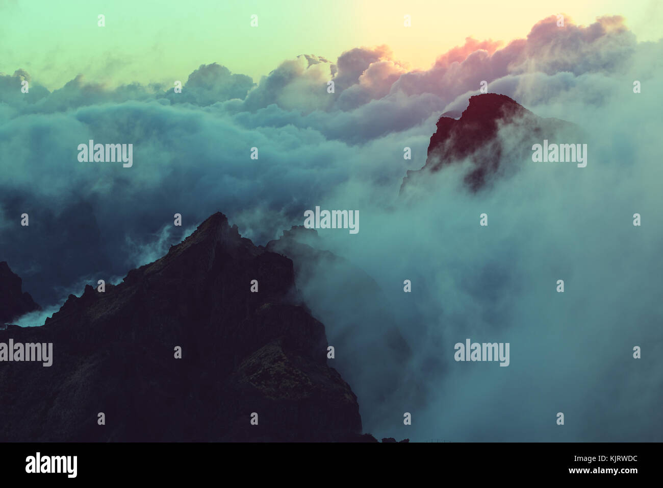Beautiful sunset on the hill above clouds Stock Photo - Alamy